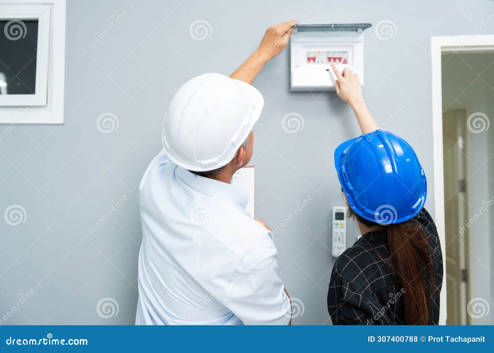 Senior Home Inspector Checking Home Defects and Teaching Young ...