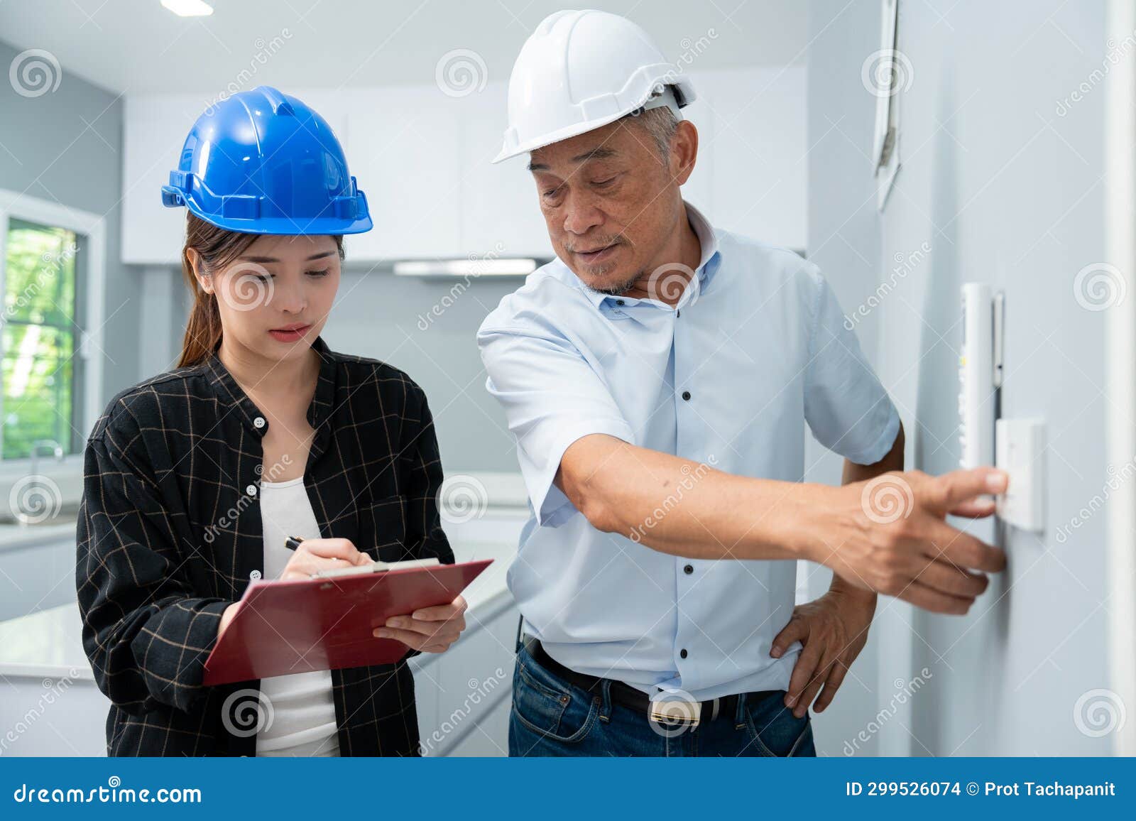 Senior Home Inspector Checking the Electrical Switch and Check Defects ...