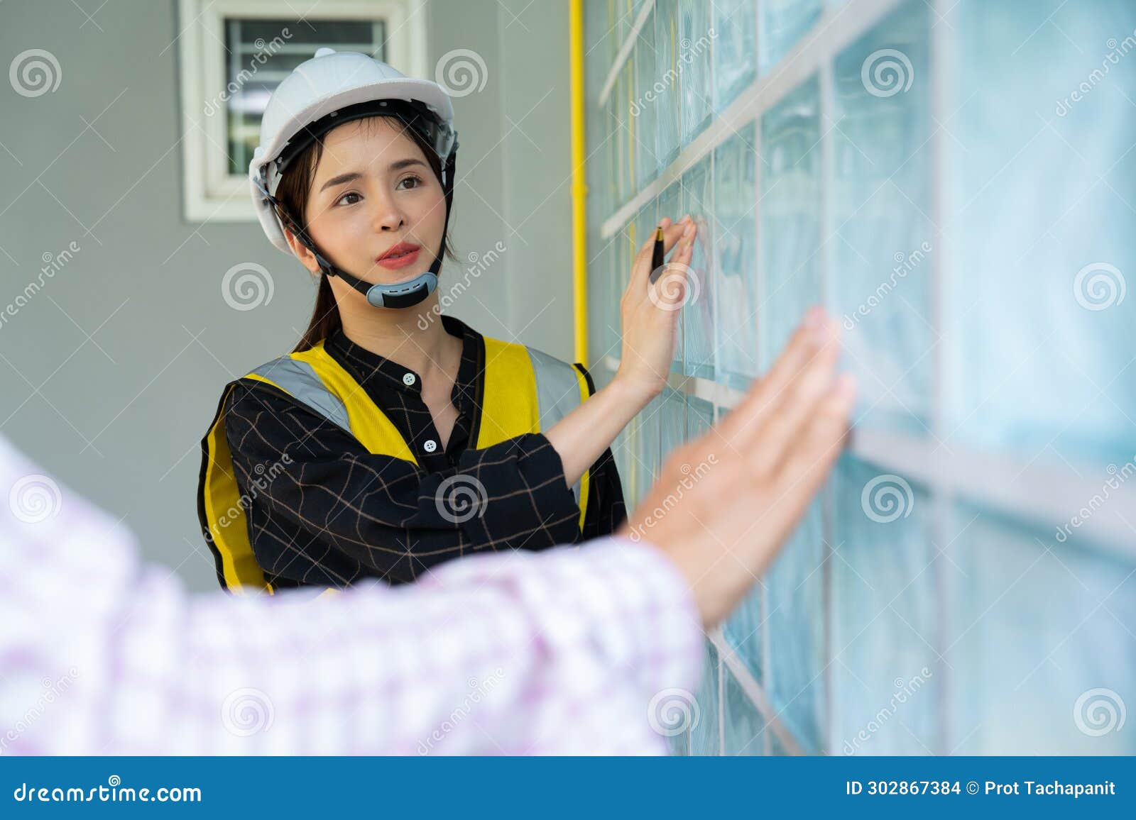 Senior Home Inspector Checking Home Defects and Teaching Young ...