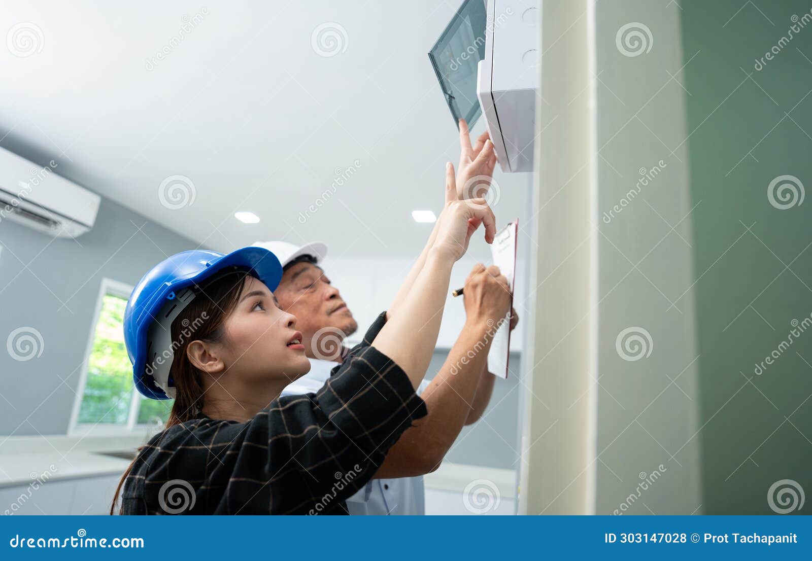 Senior Home Inspector Checking Home Defects and Teaching Young ...