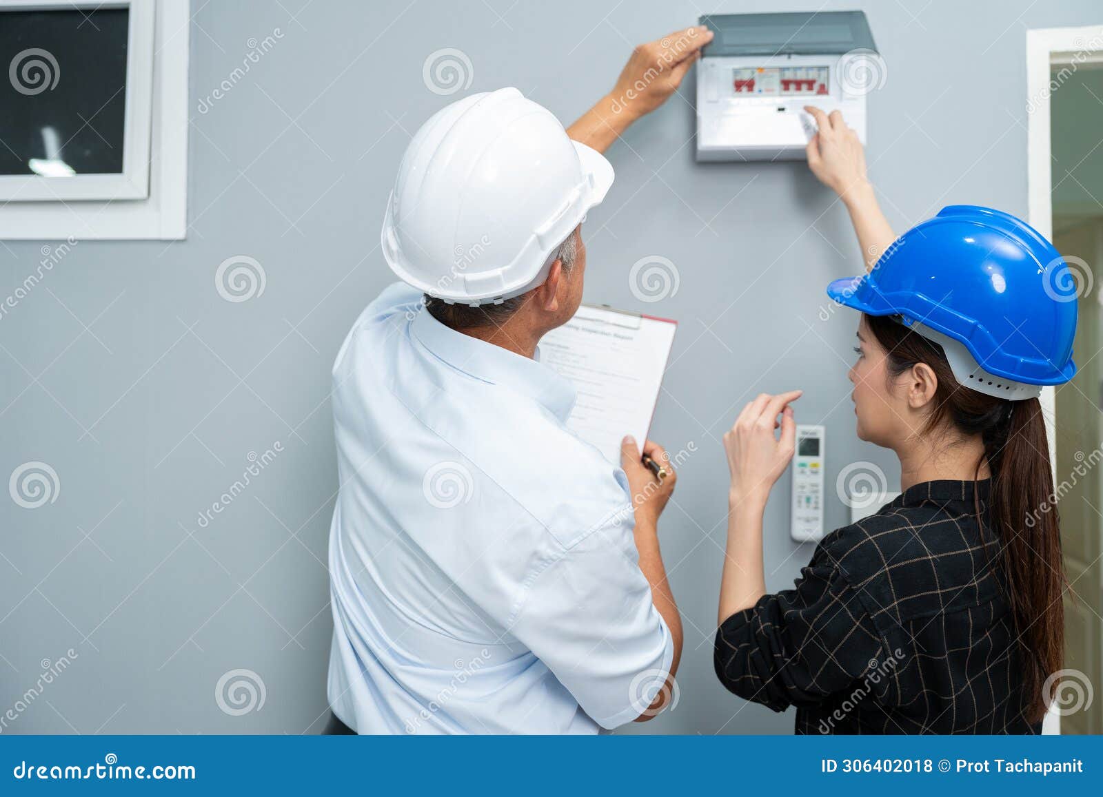 Senior Home Inspector Checking Home Defects and Teaching Young ...