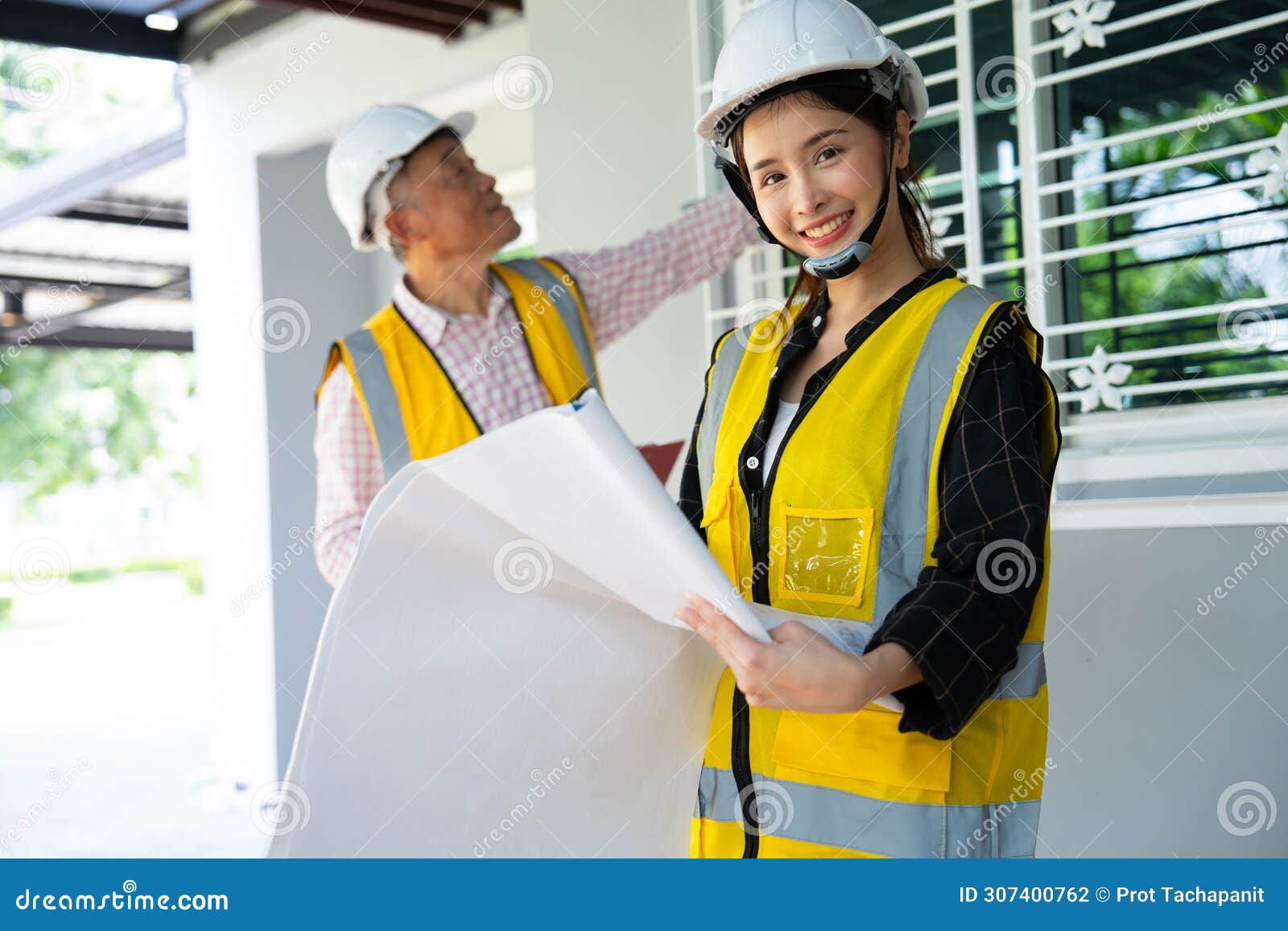 Senior Home Inspector Checking Home Defects and Teaching Young ...