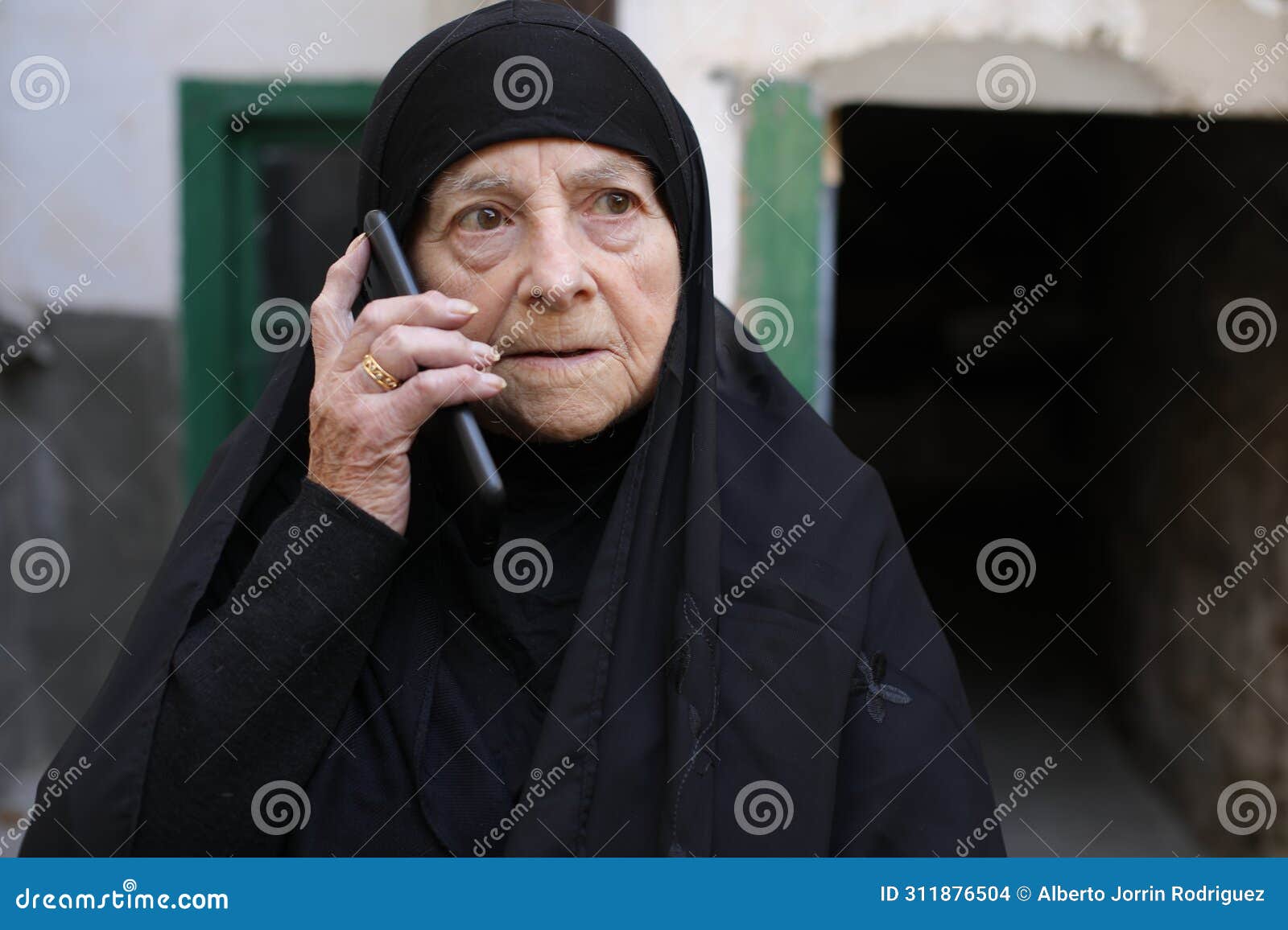 Senior Islamic Woman Getting a Phone Call Stock Photo - Image of ...