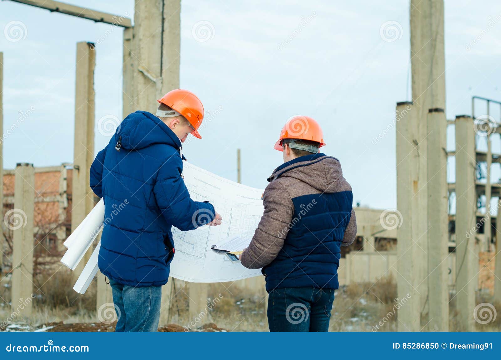 Senior and Junior Engineers Discussing Work Together Stock Photo ...