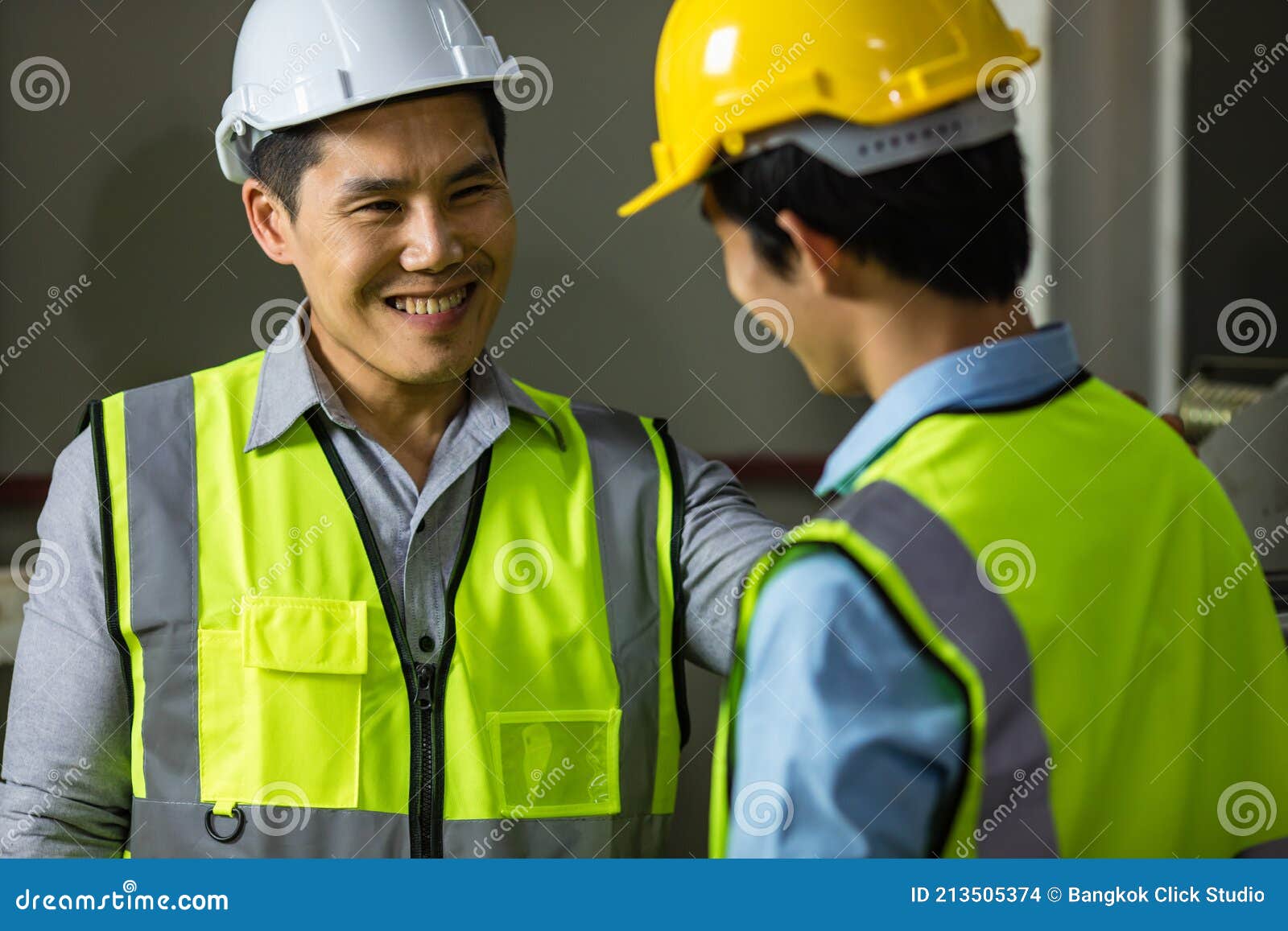 Senior and Junior Engineers Talking Together with Intimated Manner ...