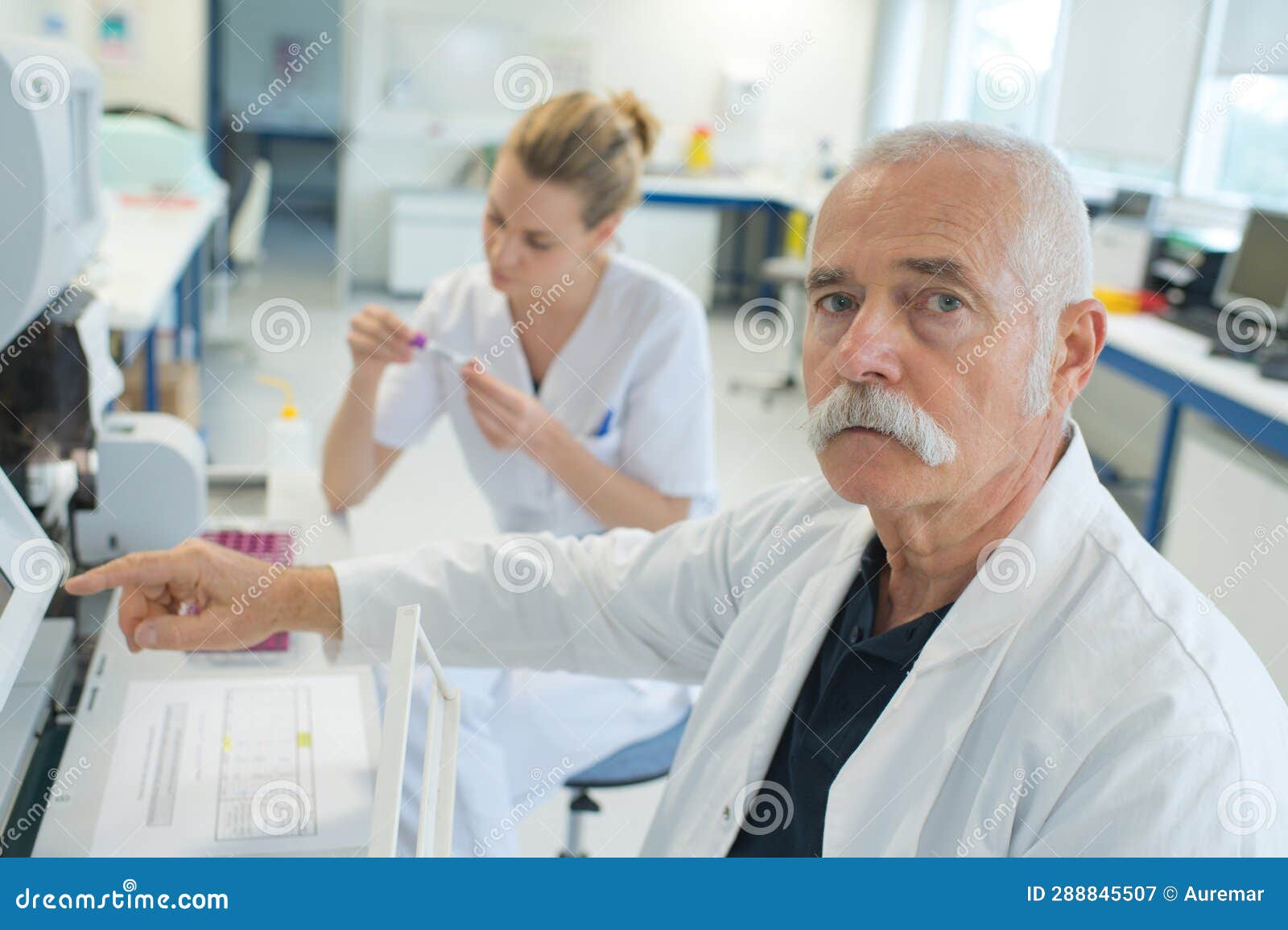 Senior Lab Worker Pointing To Computer Screen Stock Image - Image of ...