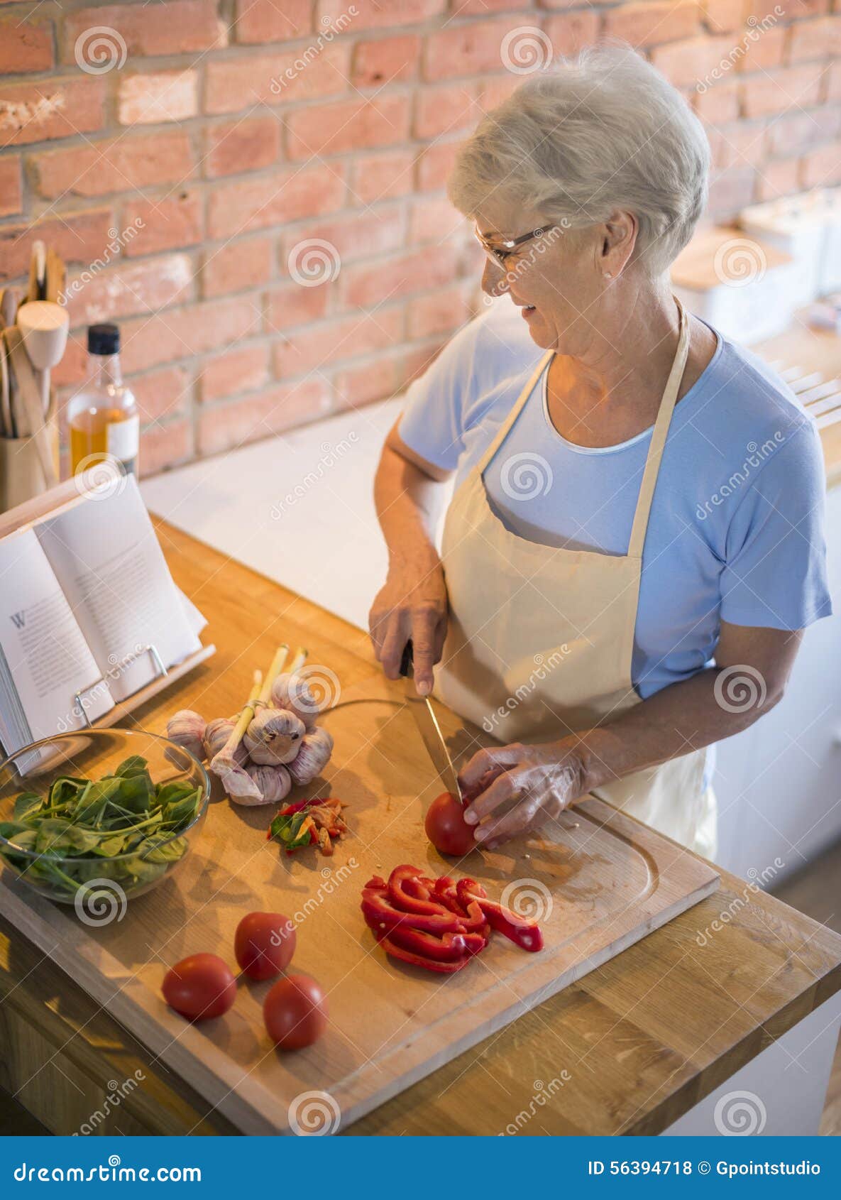 Senior lady in the kitchen stock photo. Image of enjoyment - 56394718