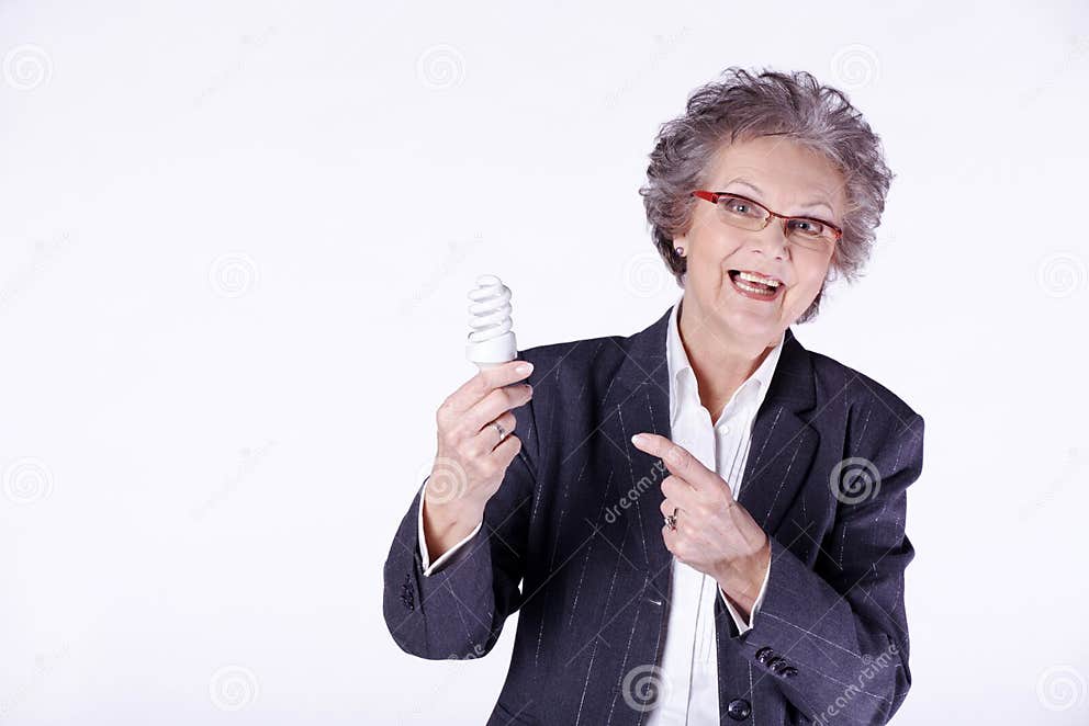 Senior Lady with Light Bulb Stock Image - Image of beautiful, indoors ...