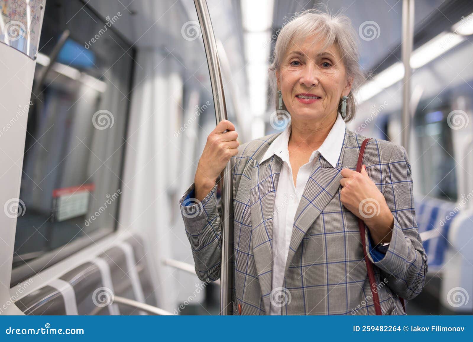 Senior Lady Standing in Metro Train Stock Photo - Image of commuter ...
