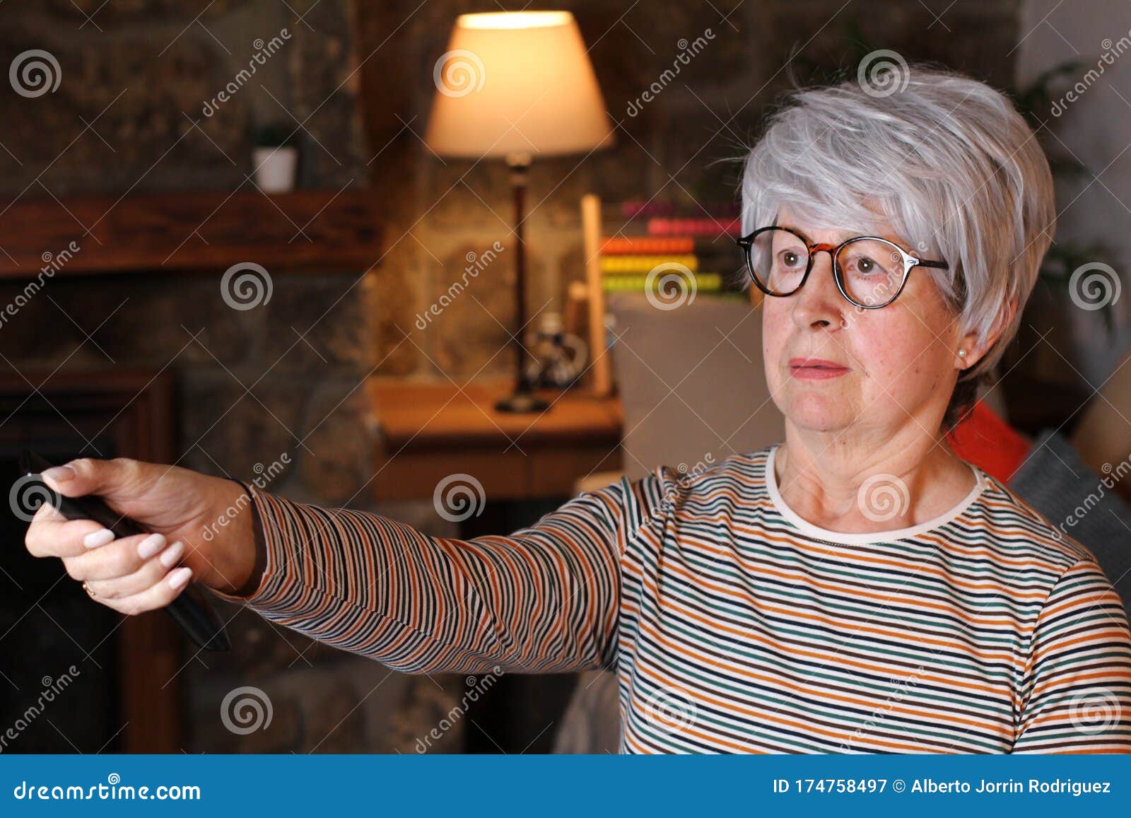 Senior Lady Using Remote Control Stock Image - Image of device ...