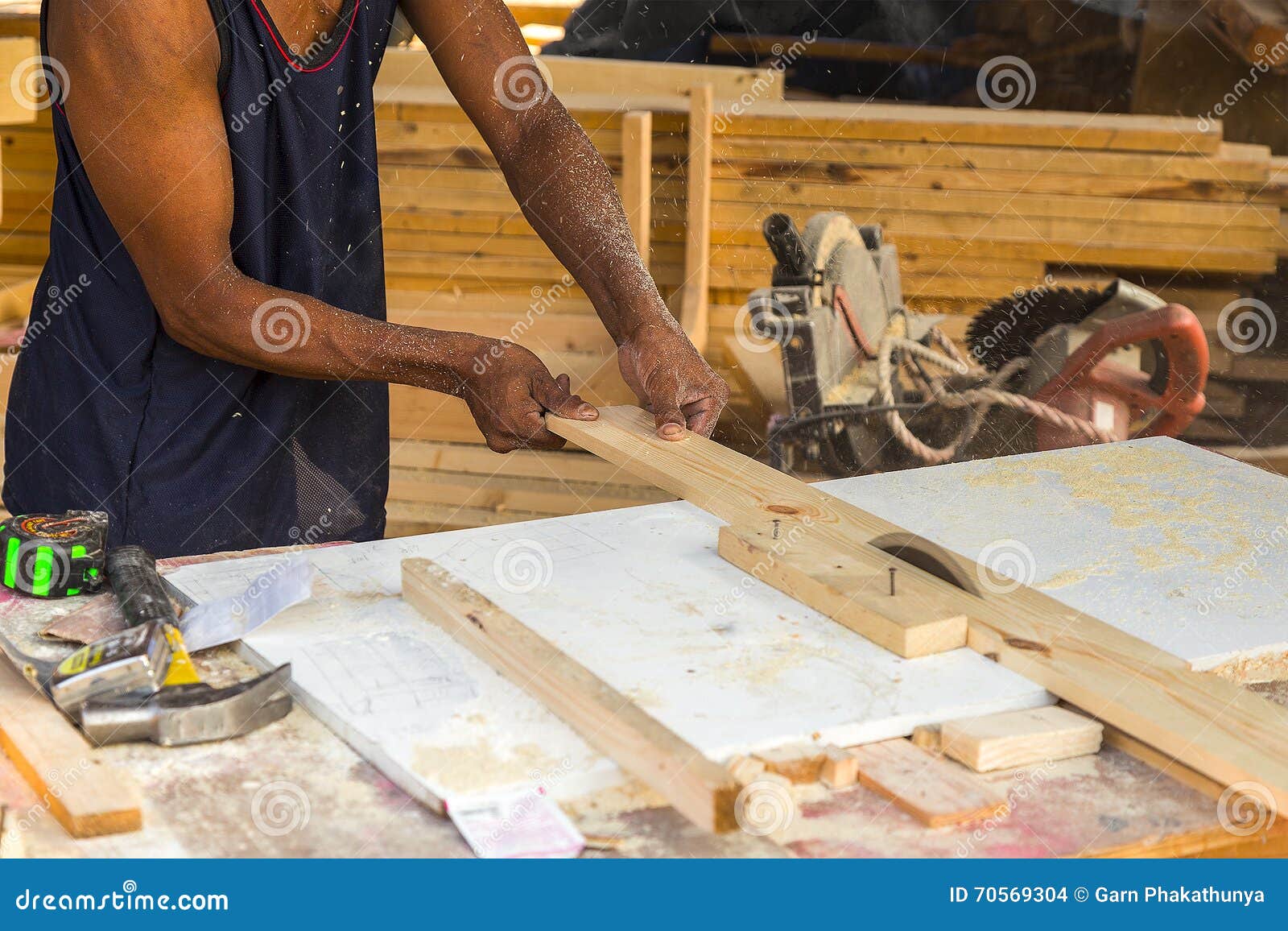 Senior Male Carpenter Using Table Saw for Cutting Wood at Workshop ...