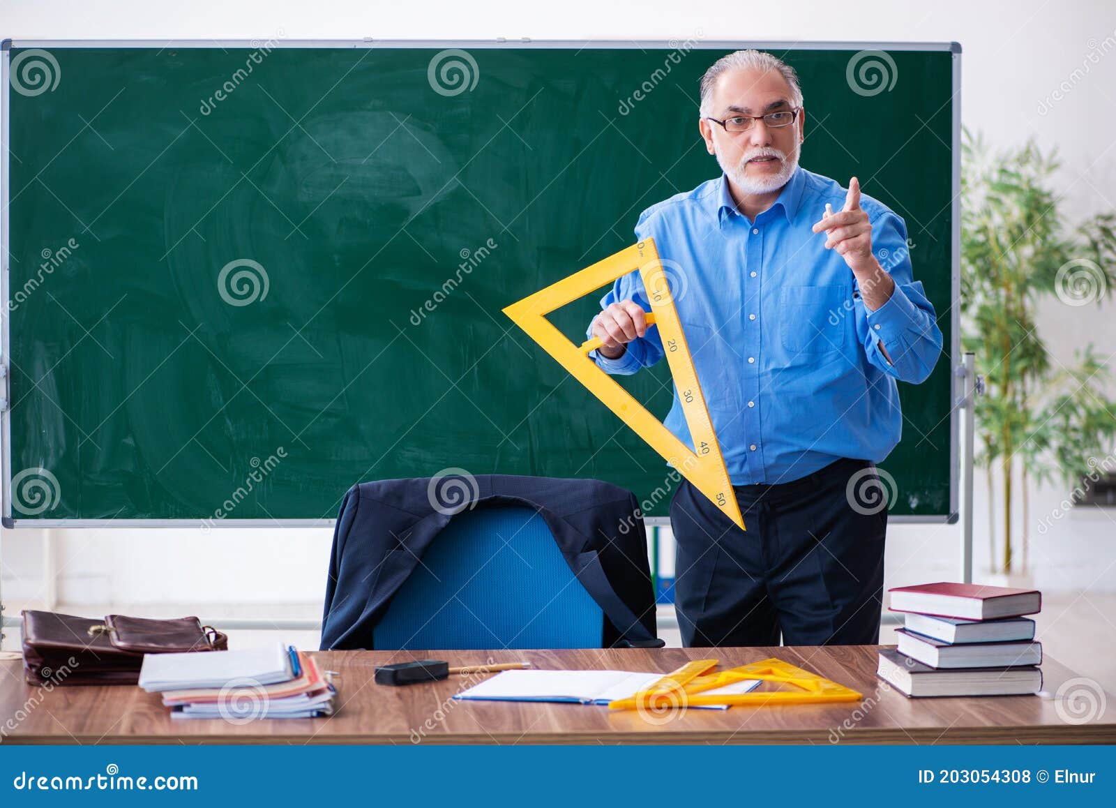 Old Male Geometry Teacher Holding Triangle Stock Photo - Image of ...