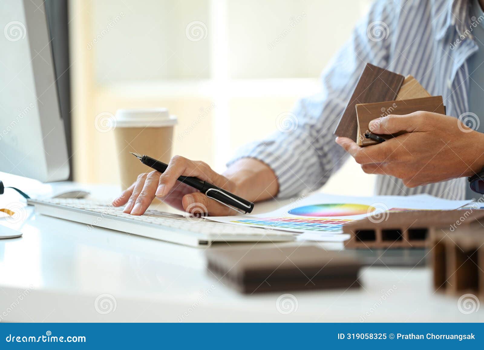 Senior Male Interior Designer Choosing Material Samples Working at ...