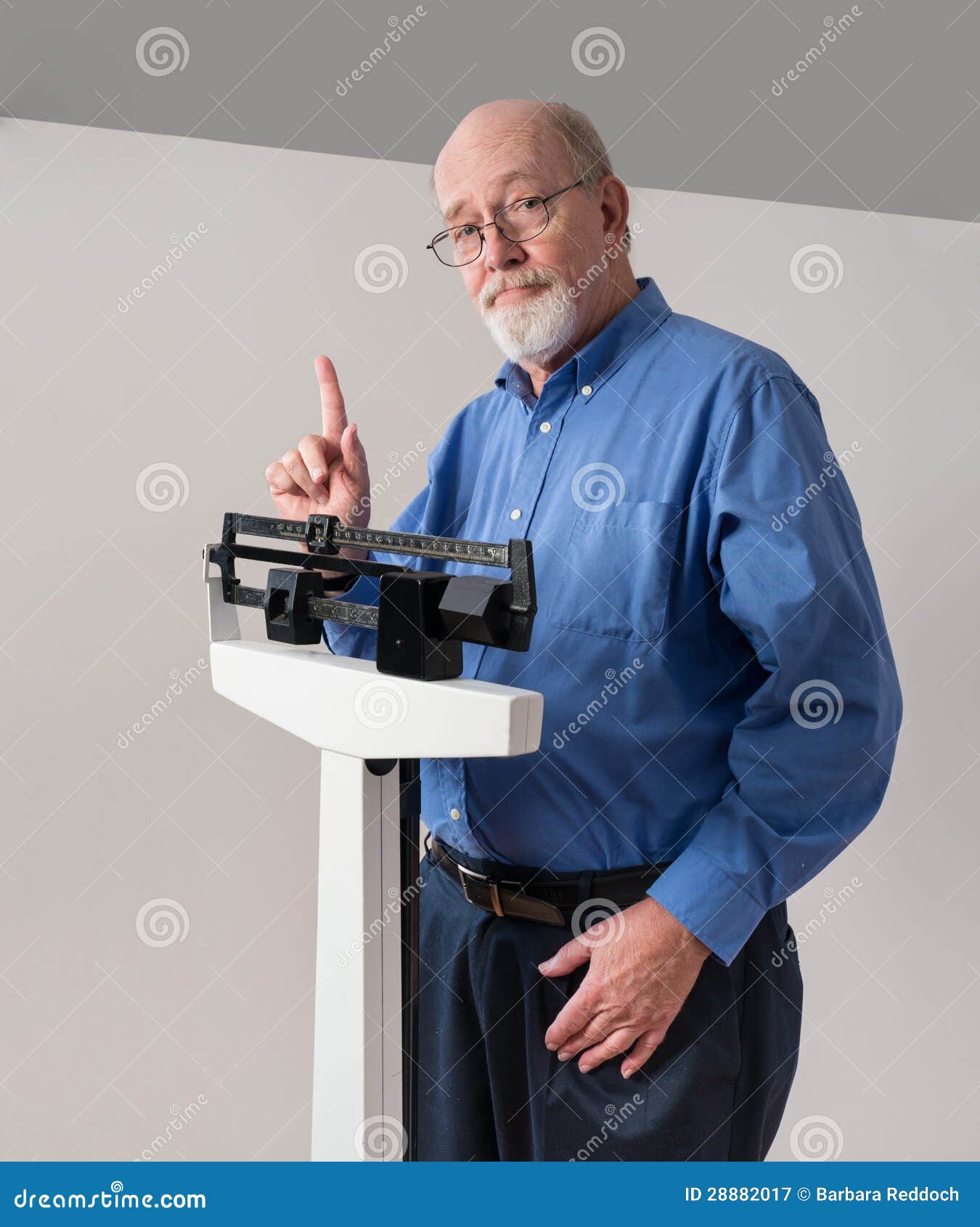 Senior Male on Weight Scale Holding Up One Finger Stock Image - Image ...