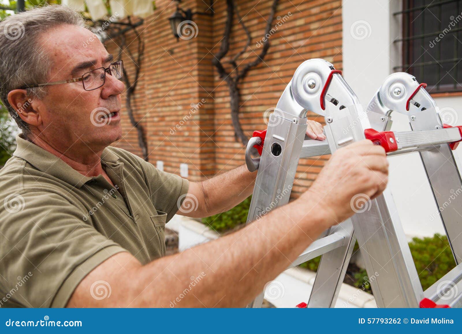 Senior Man Adjusting a Ladder. Garden Works. Stock Photo - Image of ...