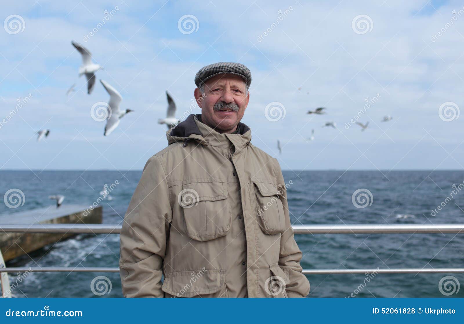 Senior man against the sea stock photo. Image of male - 52061828