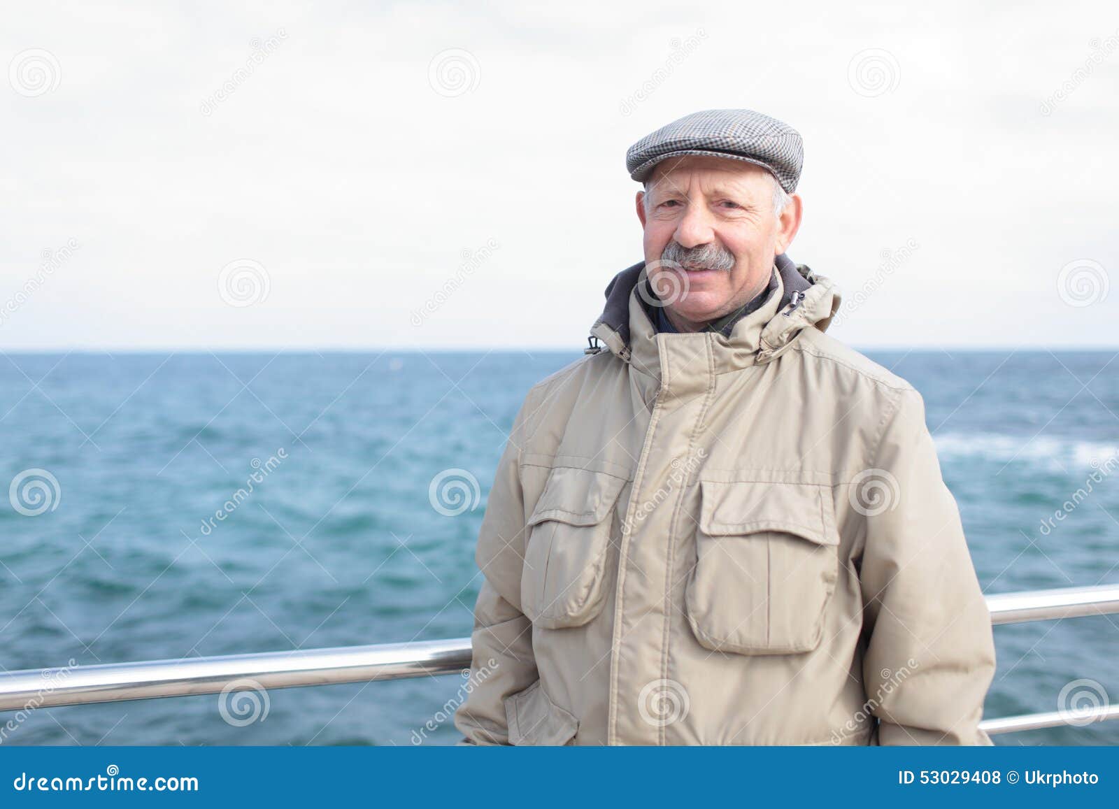 Senior man against the sea stock photo. Image of male - 53029408
