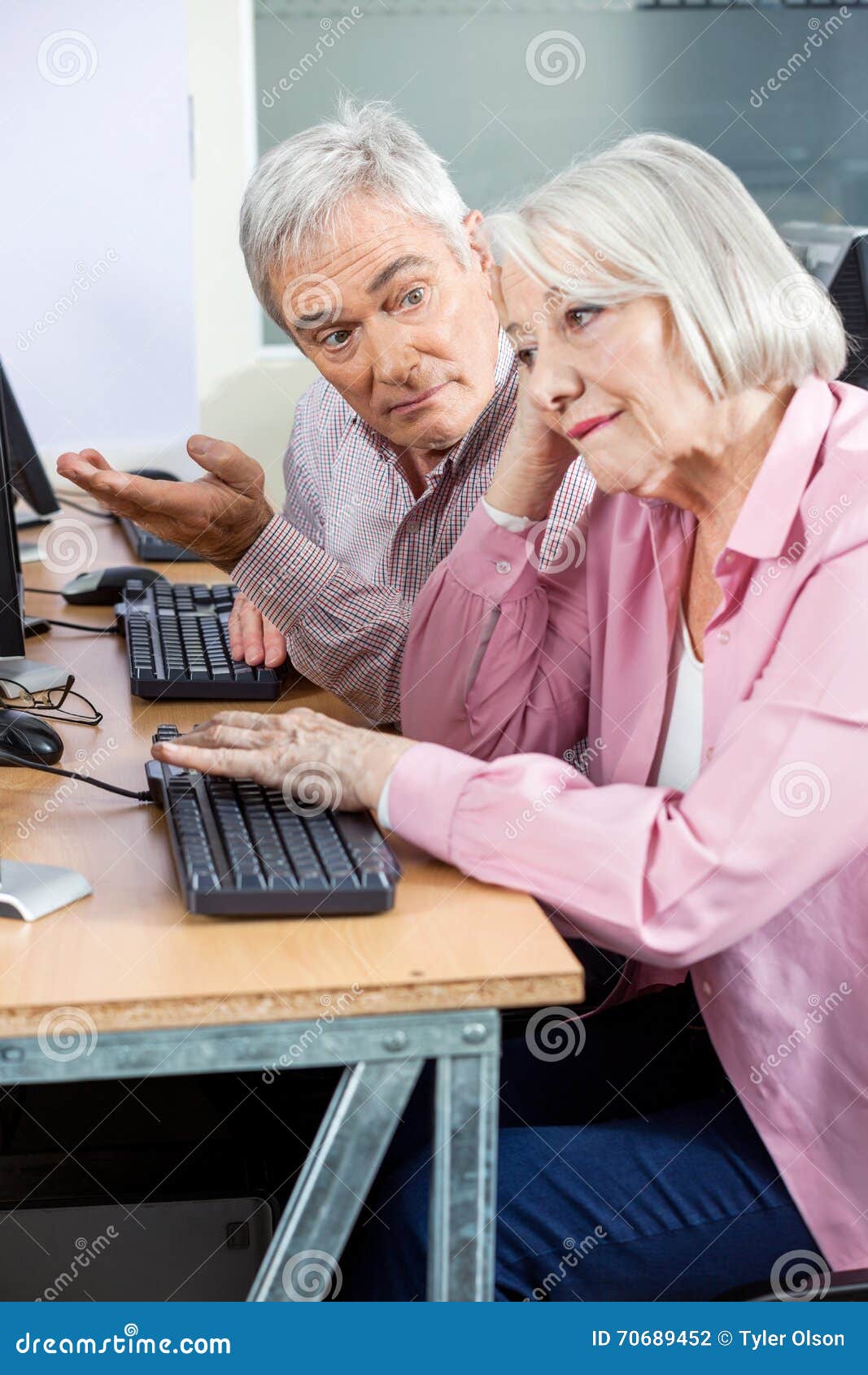 Senior Man Asking Questions To Bored Classmate in Computer Class Stock ...