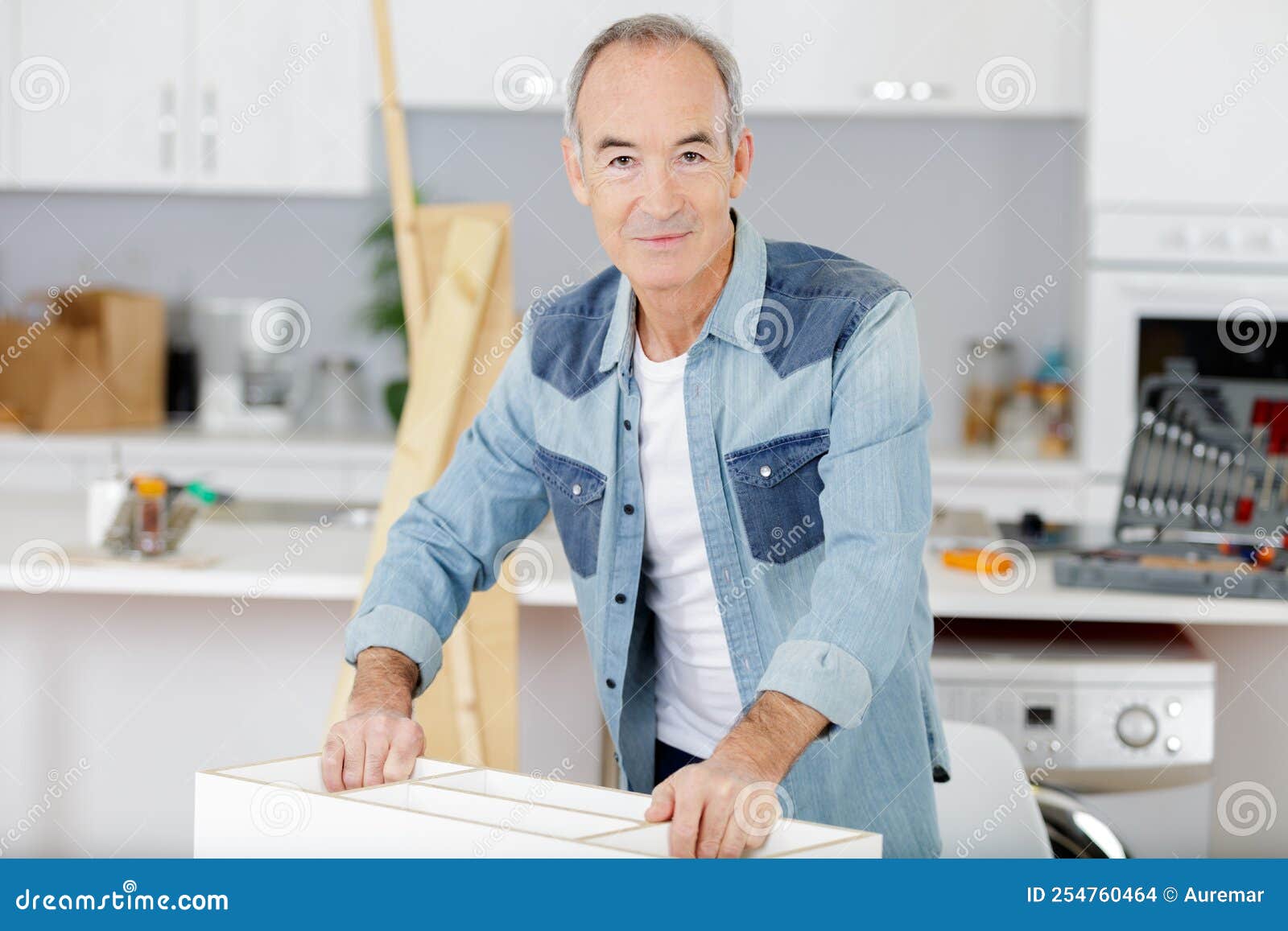 Senior Man Assembling Flat Pack Furniture Stock Photo - Image of ...