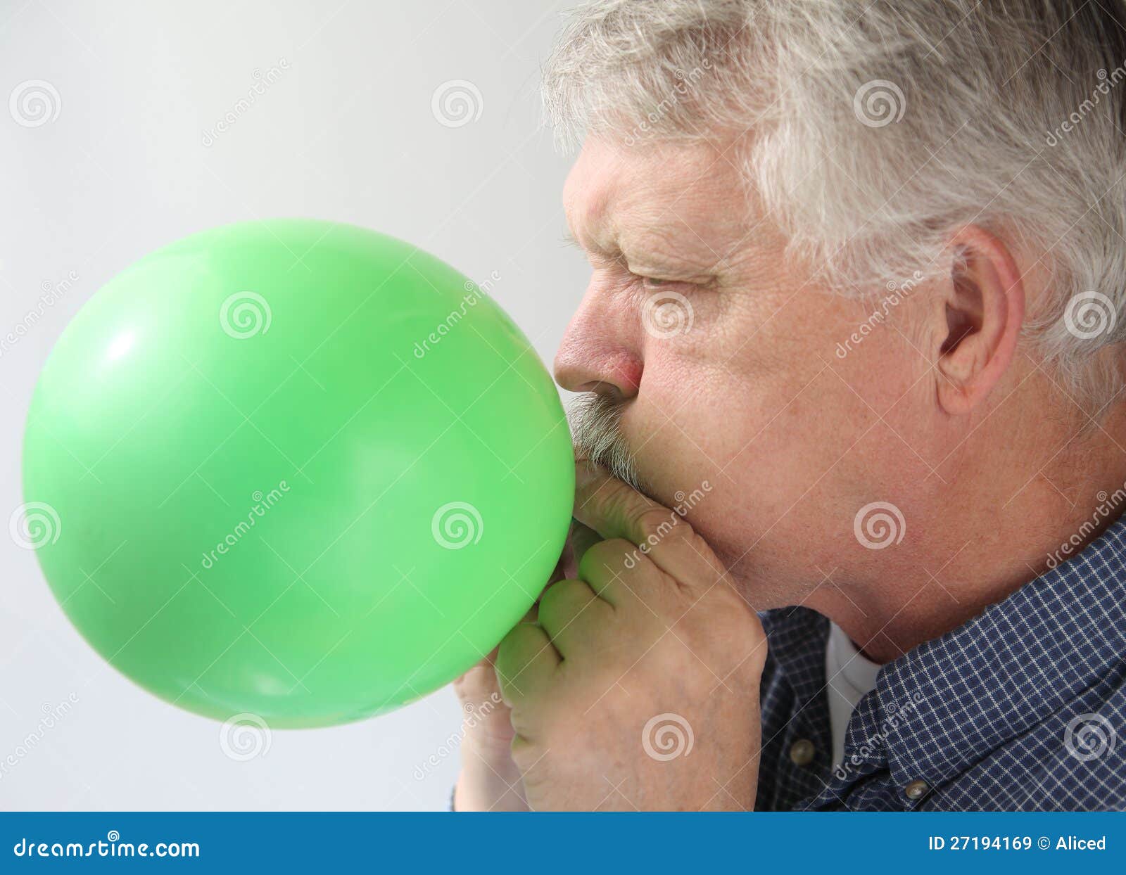 Senior Man Blowing Up Balloon Stock Image - Image of hand, face: 27194169