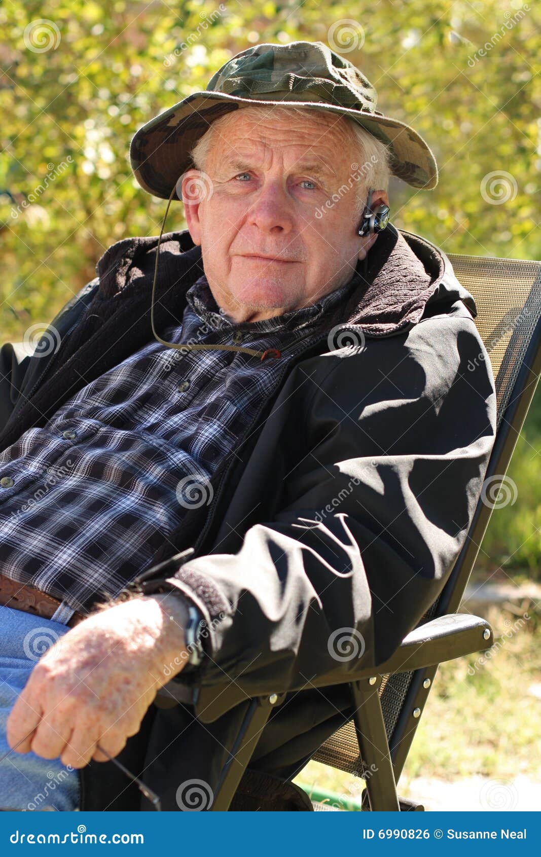 Senior man with bluetooth stock photo. Image of greenery - 6990826