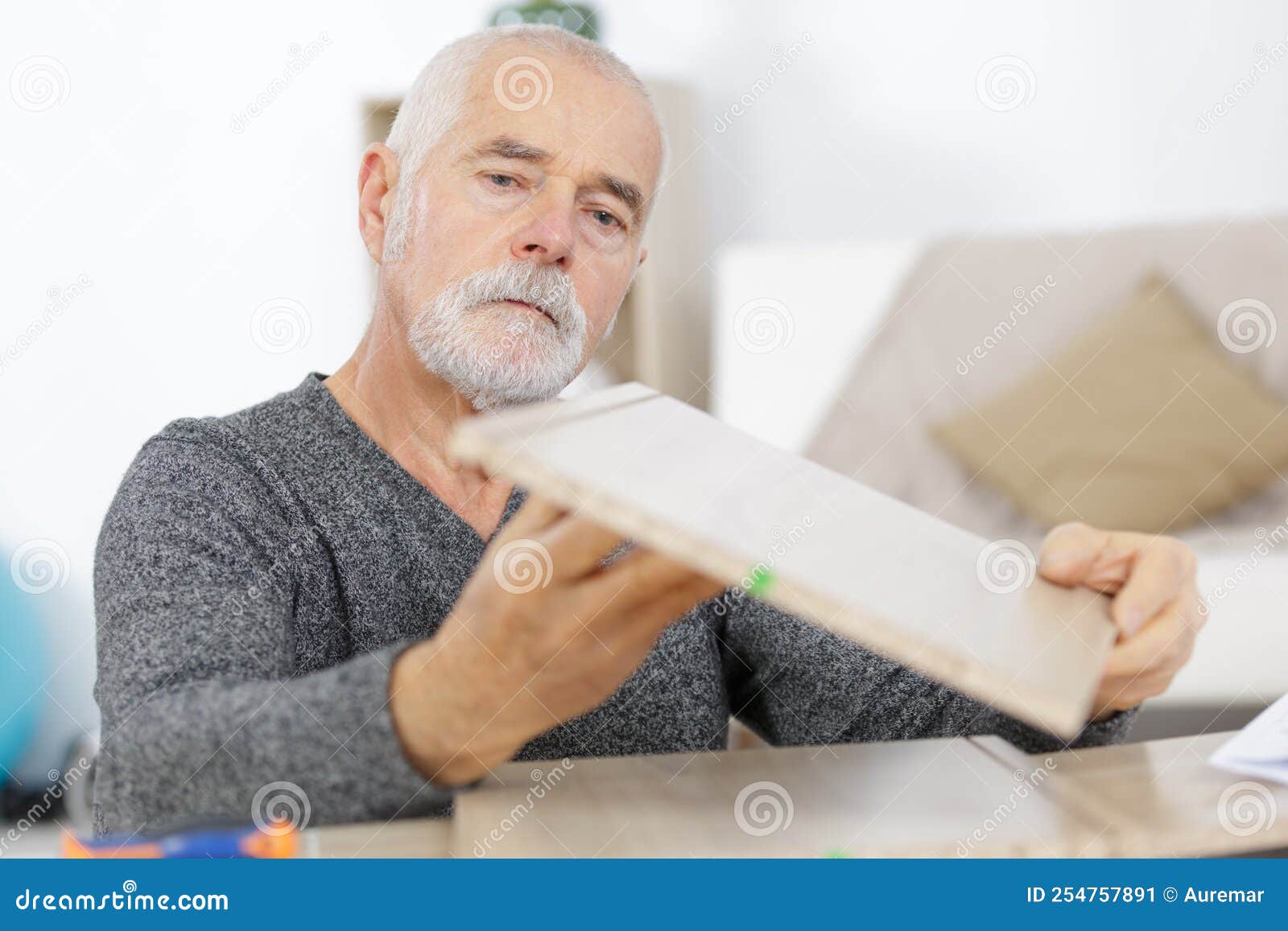 Senior man checking wood stock image. Image of beard - 254757891