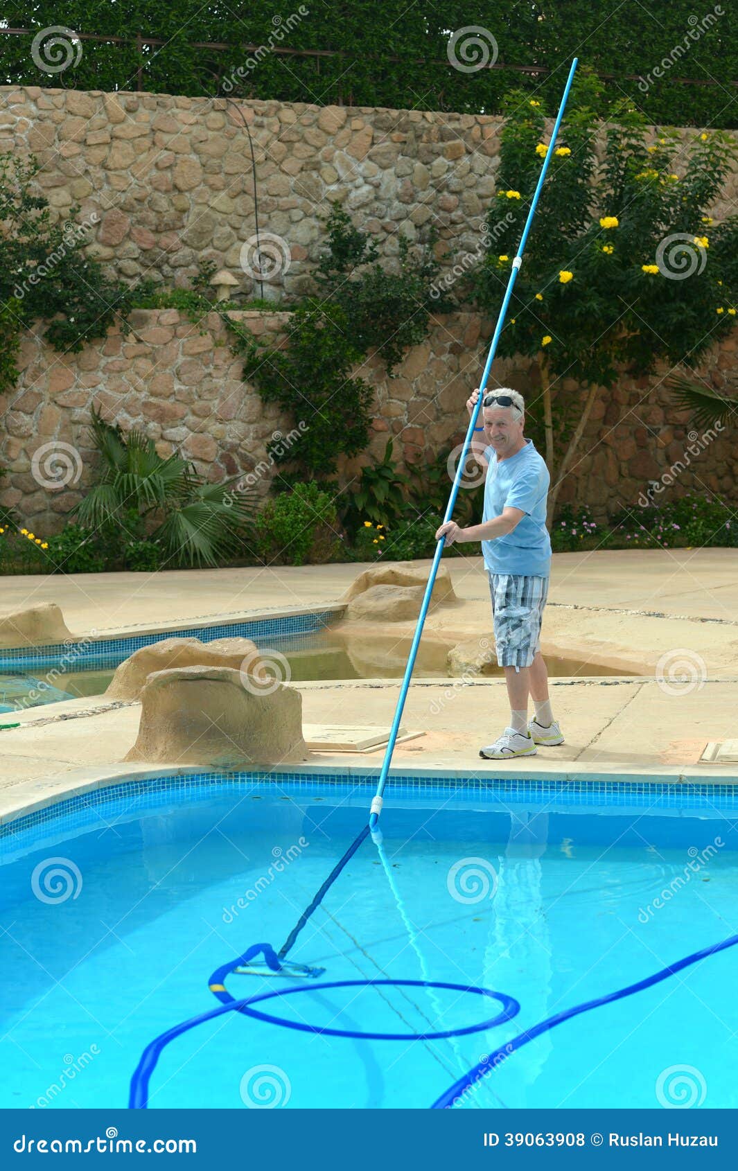 Senior man cleaning pool stock photo. Image of outdoors - 39063908