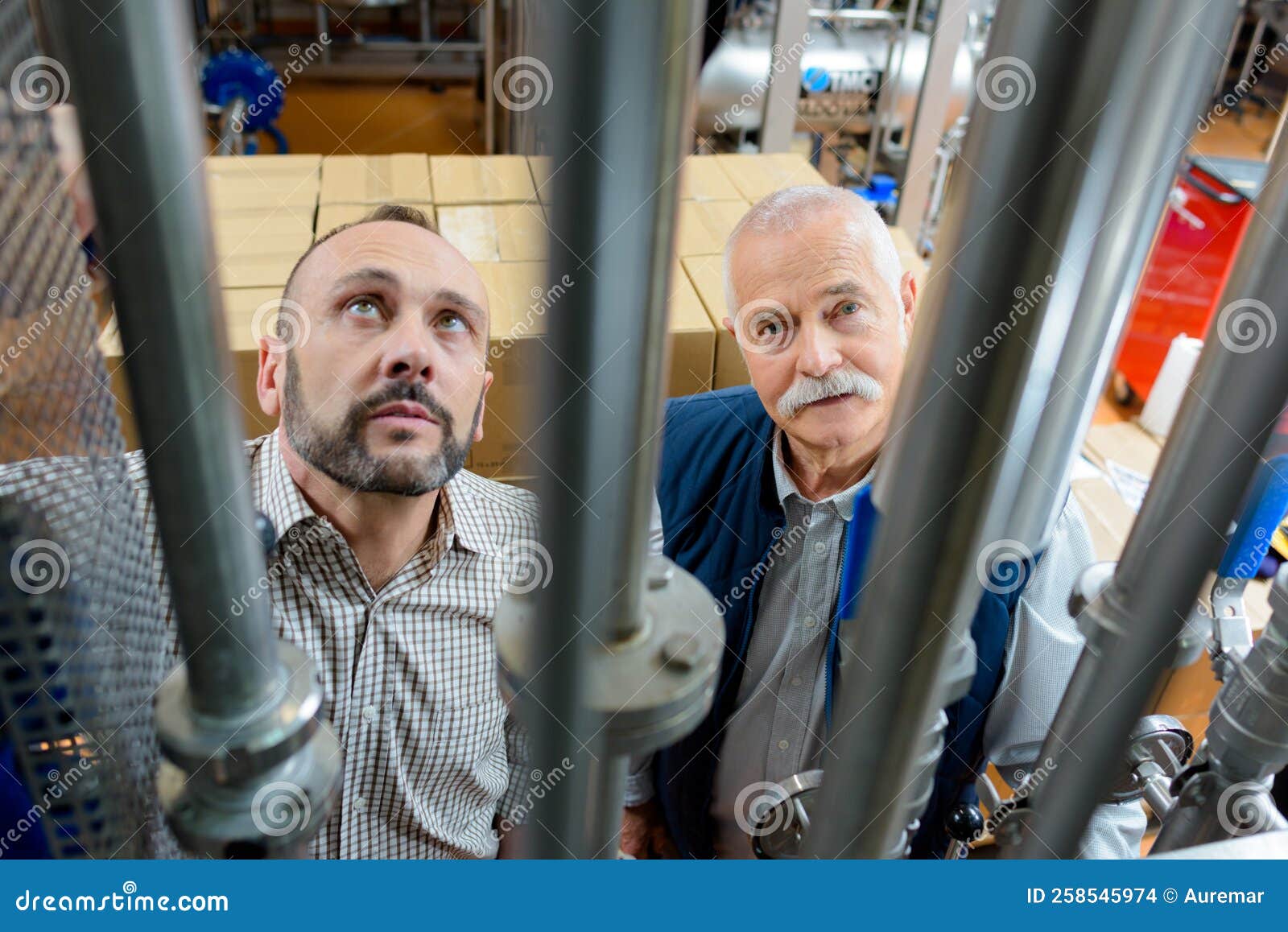 Senior Man and Co-worker Looking Up into Racking Stock Photo - Image of ...