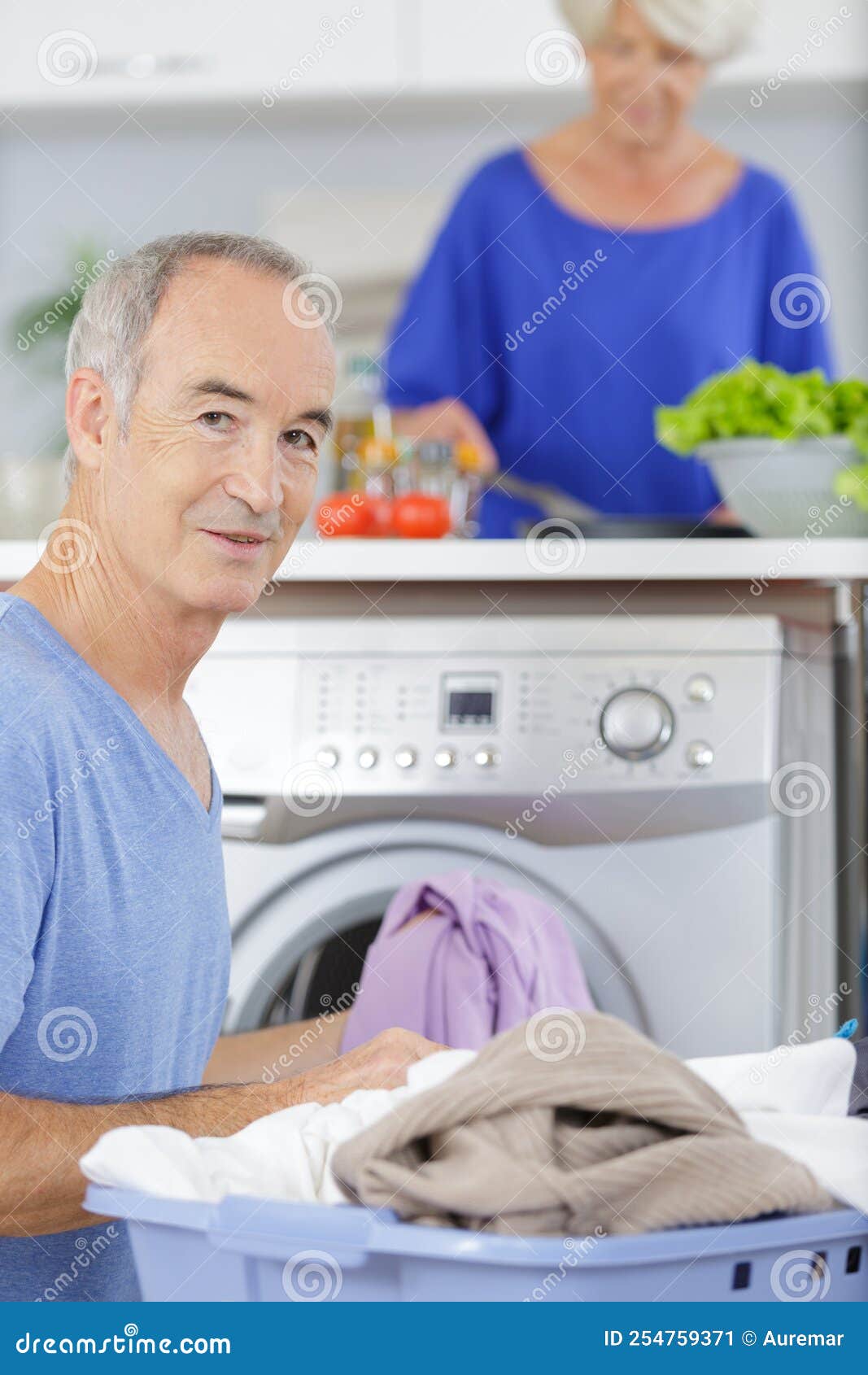 Senior man doing laundry stock image. Image of lifestyle - 254759371
