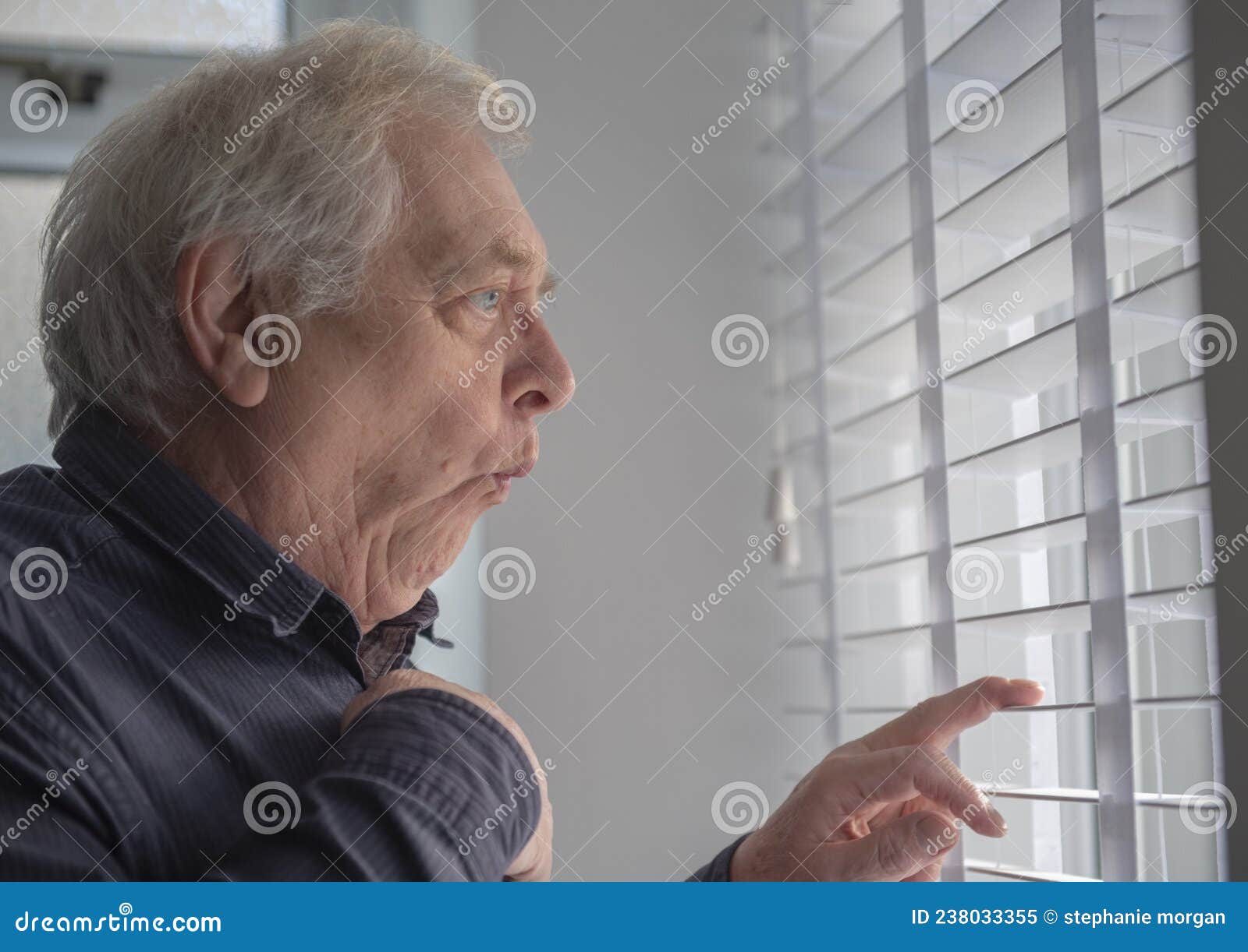 Senior Man with Funny Facial Expression Spying through Window Stock ...