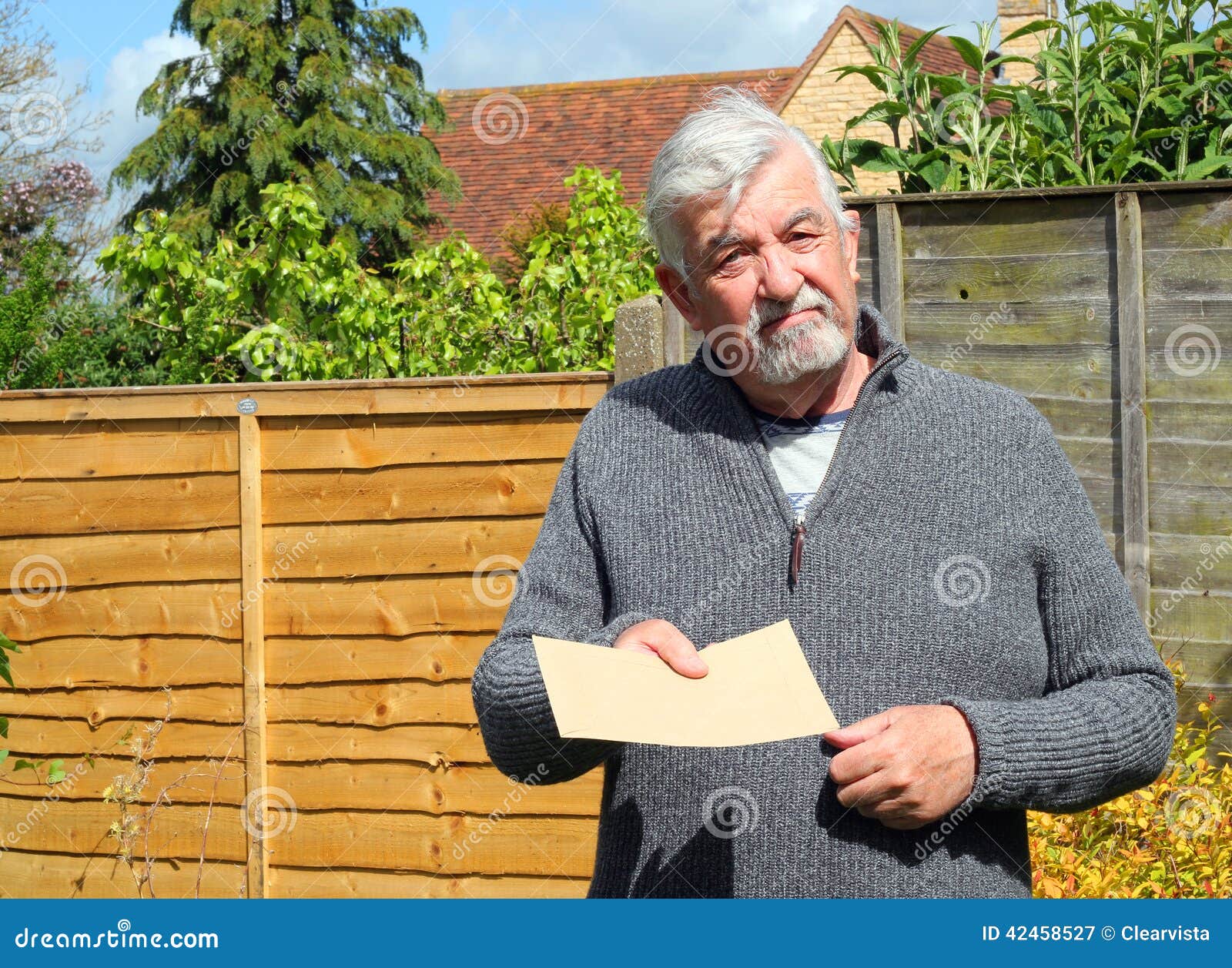 Senior Man Giving a Plain Brown Envelope. Stock Image - Image of giving ...