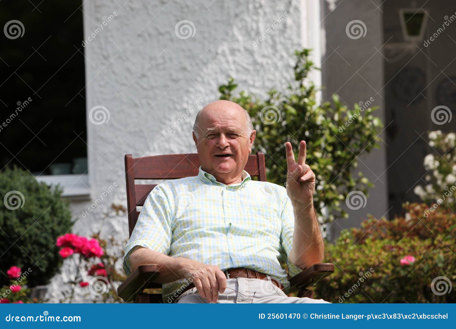 Senior man giving V-sign stock photo. Image of balding - 25601470