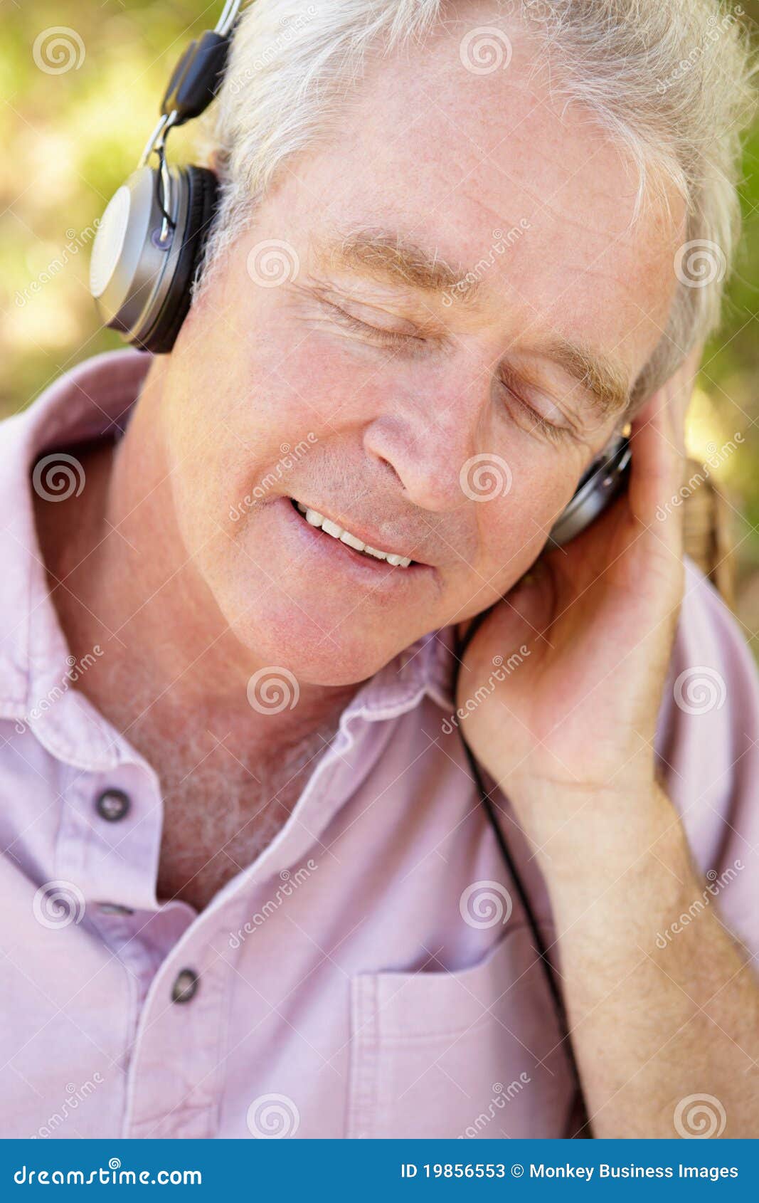 Senior man with headphone stock image. Image of green - 19856553