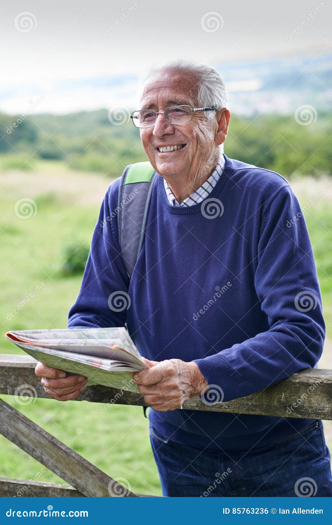 Senior Man Hiking in Countryside Looking at Map Stock Photo - Image of ...