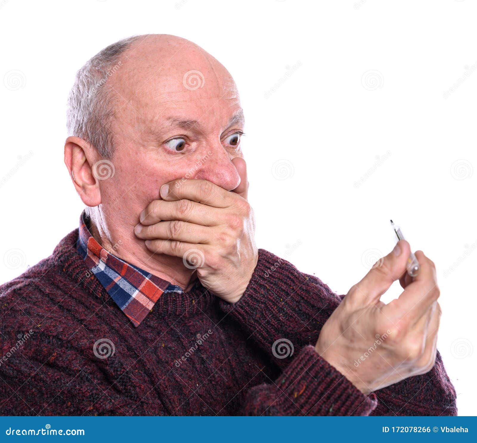 Senior Man Holding Thermometer In Hands Measuring Body Temperature