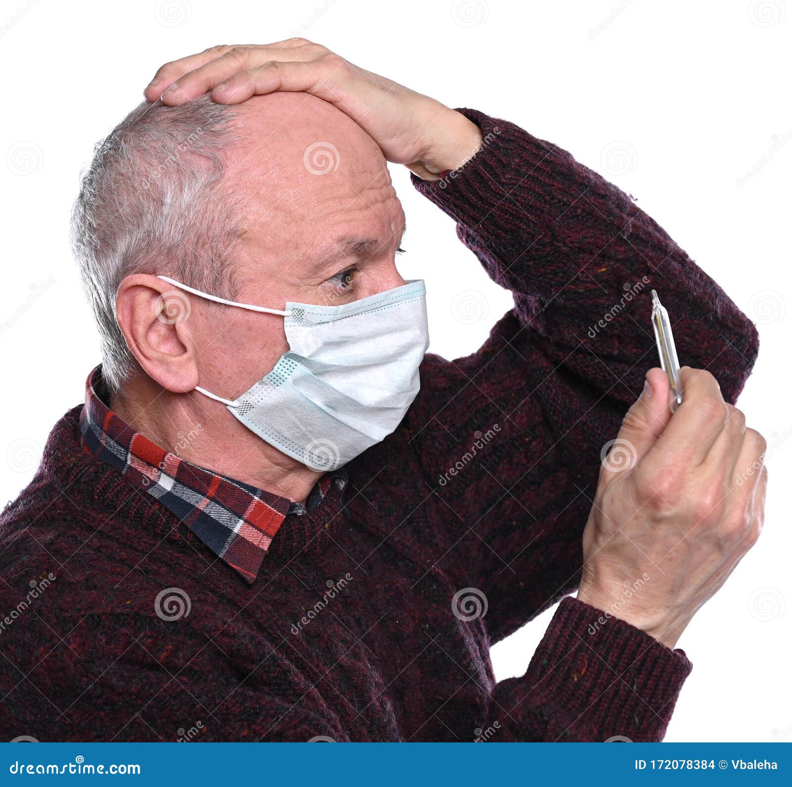 Senior Man Holding Thermometer In Hands Measuring Body Temperature