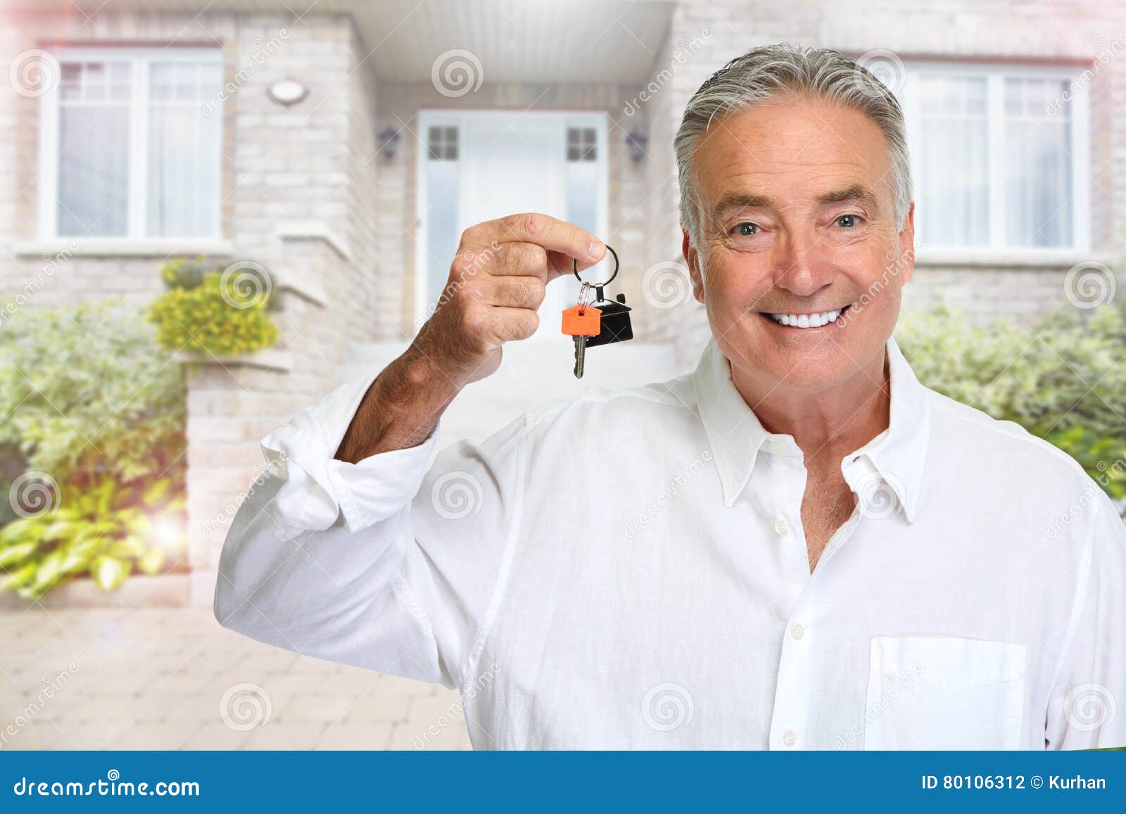 Senior man with house key. stock photo. Image of estate - 80106312