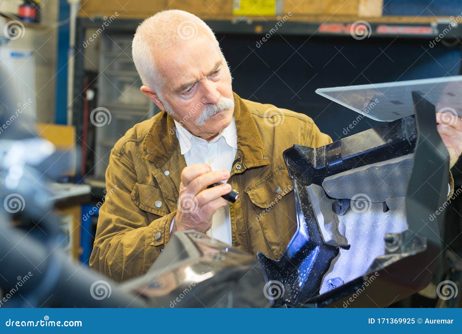 Senior Man Inspecting Motorbike Stock Image - Image of athome, bike ...
