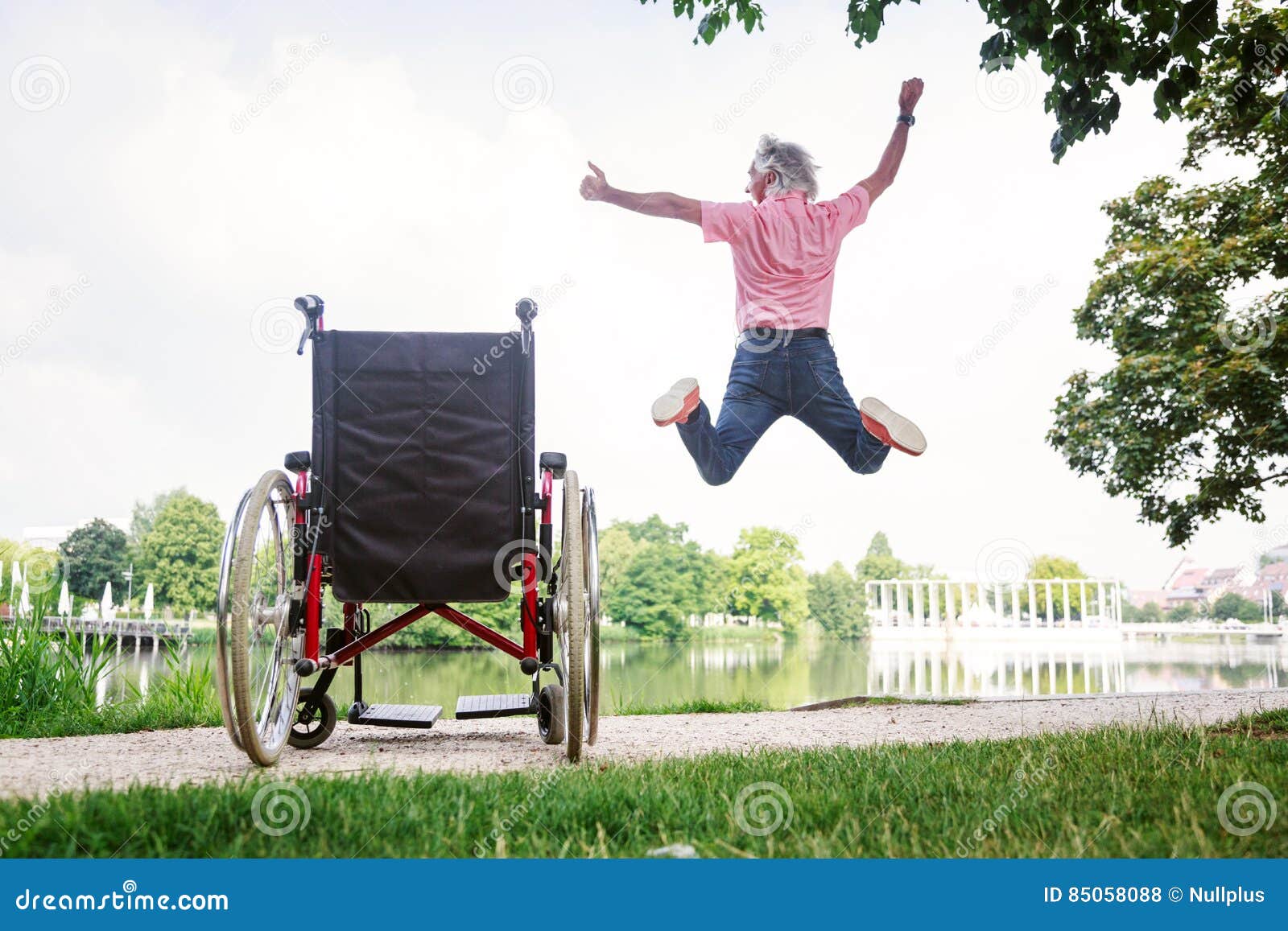 Senior Man Jumping Up from Wheelchair Stock Photo - Image of healthcare ...