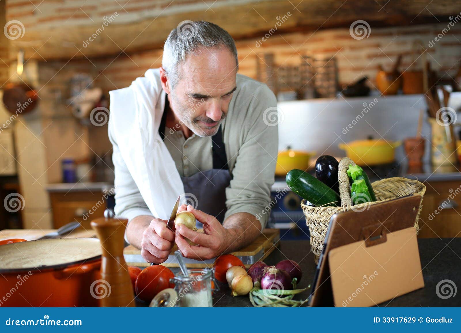 Senior Man in Kitchen Using Tablet during Cooking Stock Image - Image ...