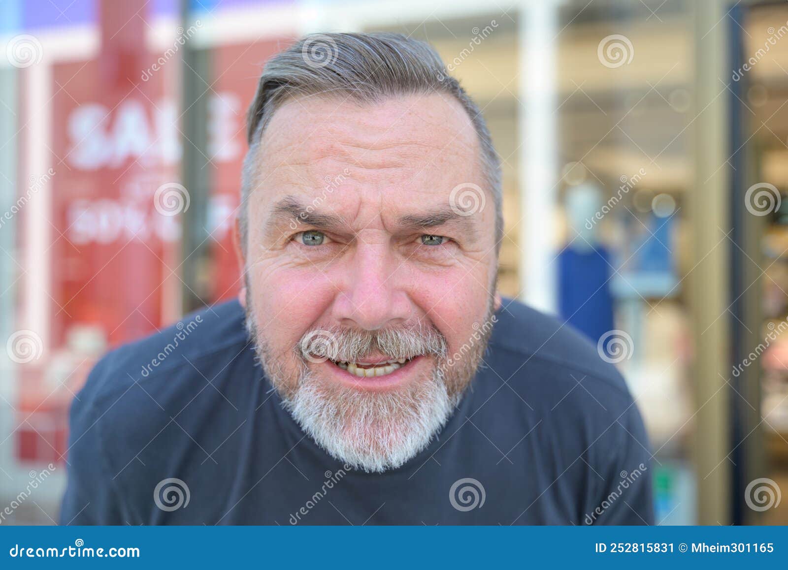 Senior Man Leaning Forwards Staring into the Camera Stock Image - Image ...