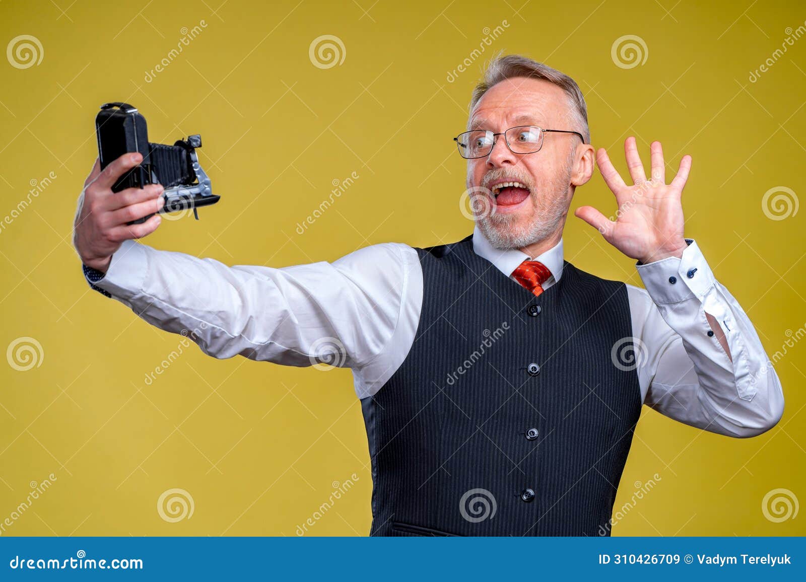 Senior Man Looking at Camera while Taking Silly Face Selfie. Waving To ...