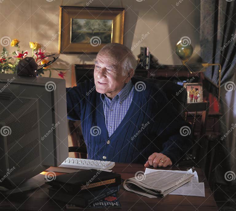 Senior Man Looking at Computer Appearing Content Stock Photo - Image of ...