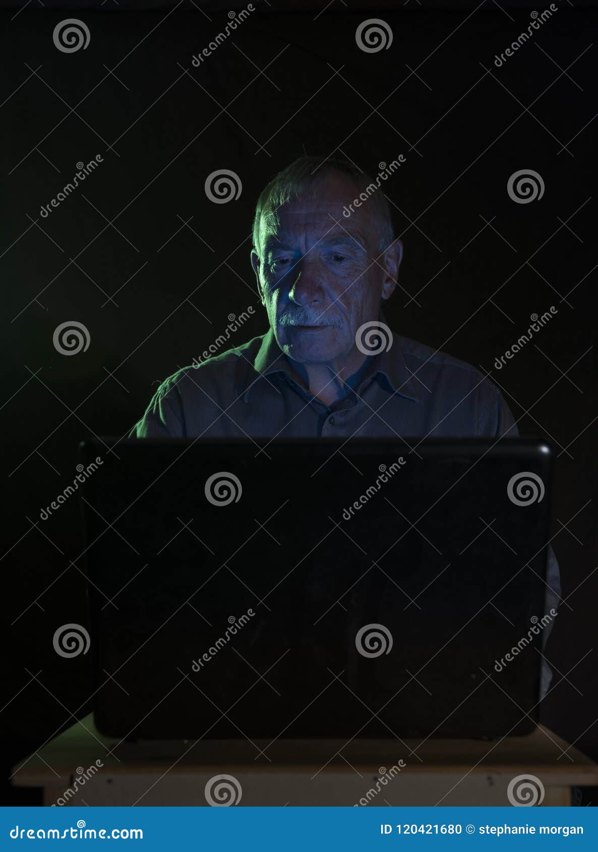 Senior Man Looking at a Computer Screen at Night Stock Photo - Image of ...