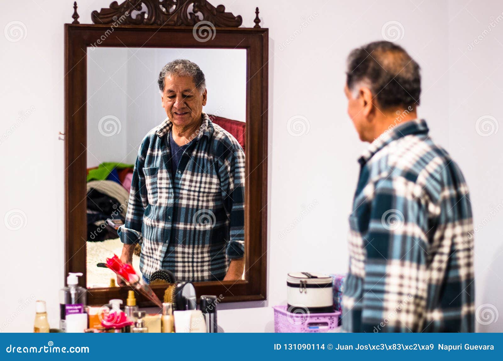 Man Looking at Himself in the Mirror Smiling Stock Photo - Image of ...