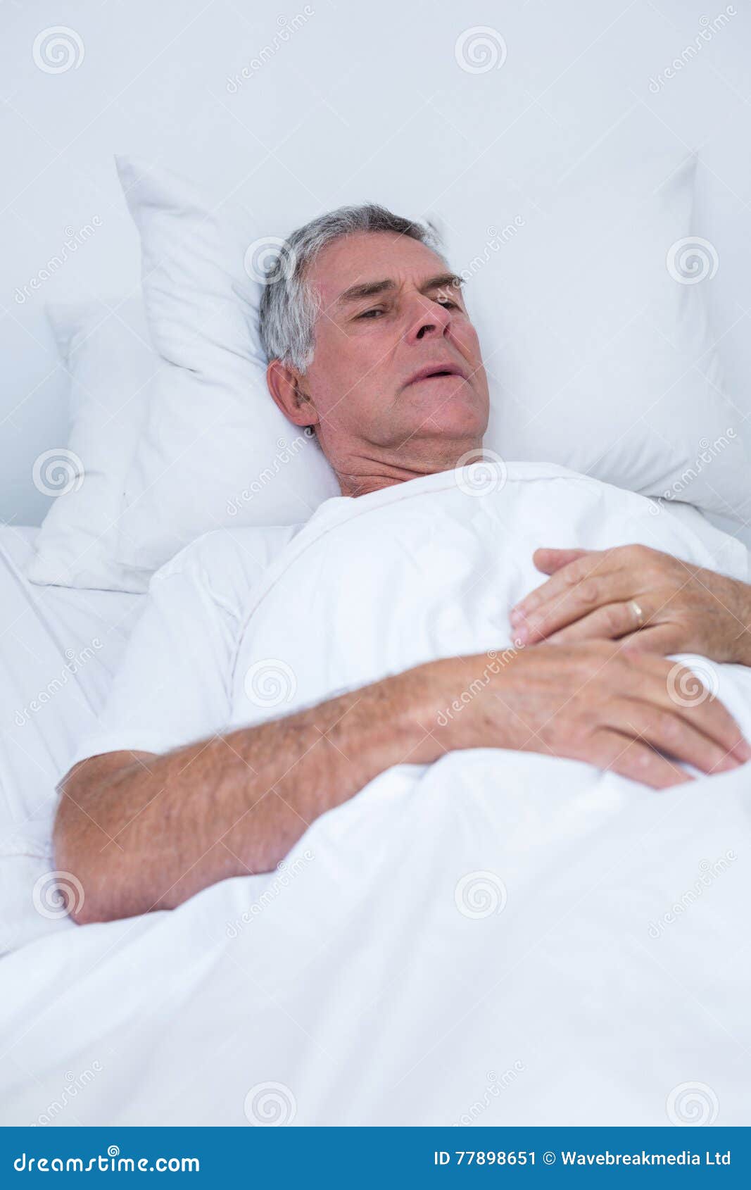 Senior man lying on bed stock image. Image of relaxing - 77898651