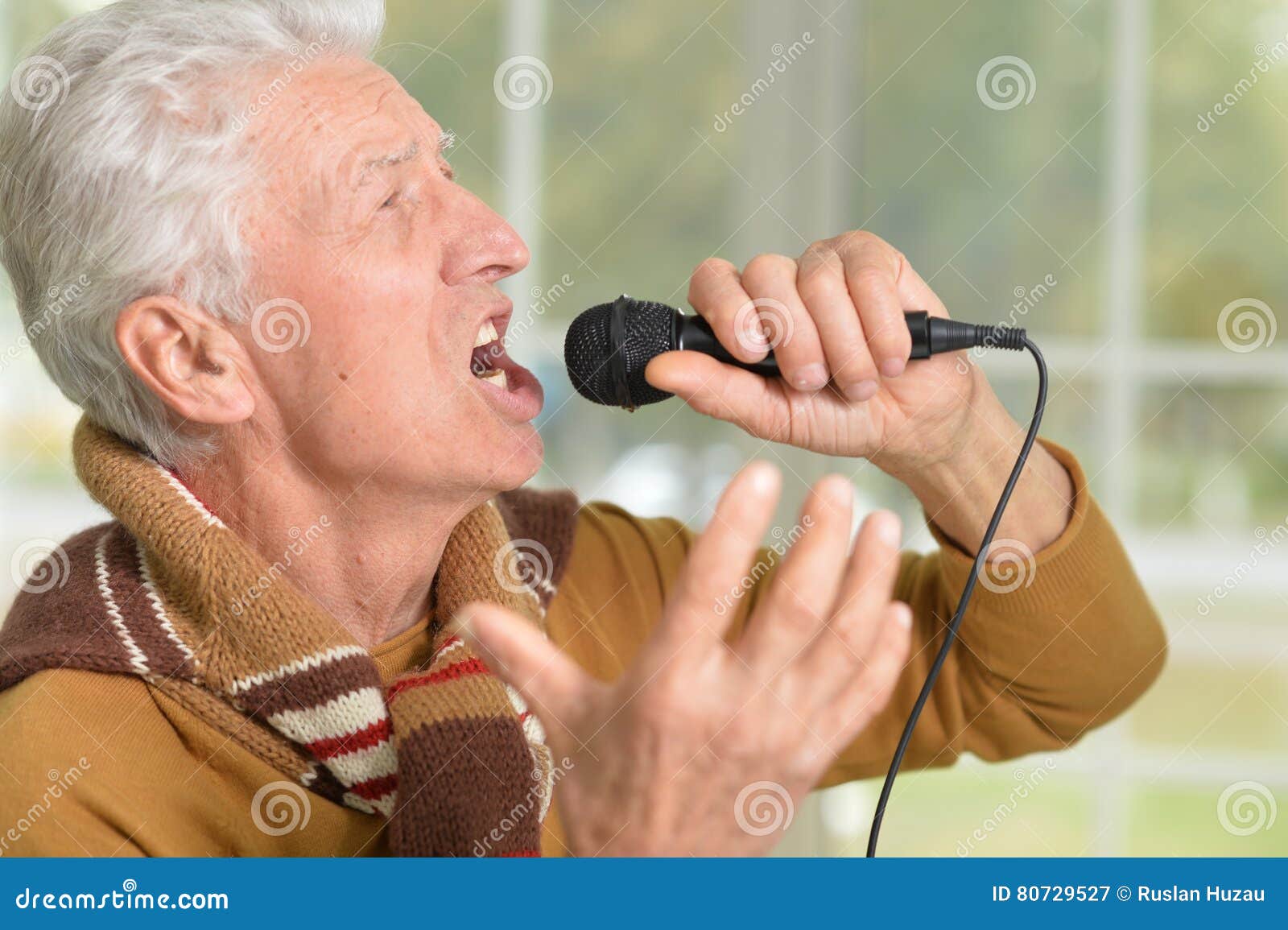 Senior man with microphone stock image. Image of singer - 80729527