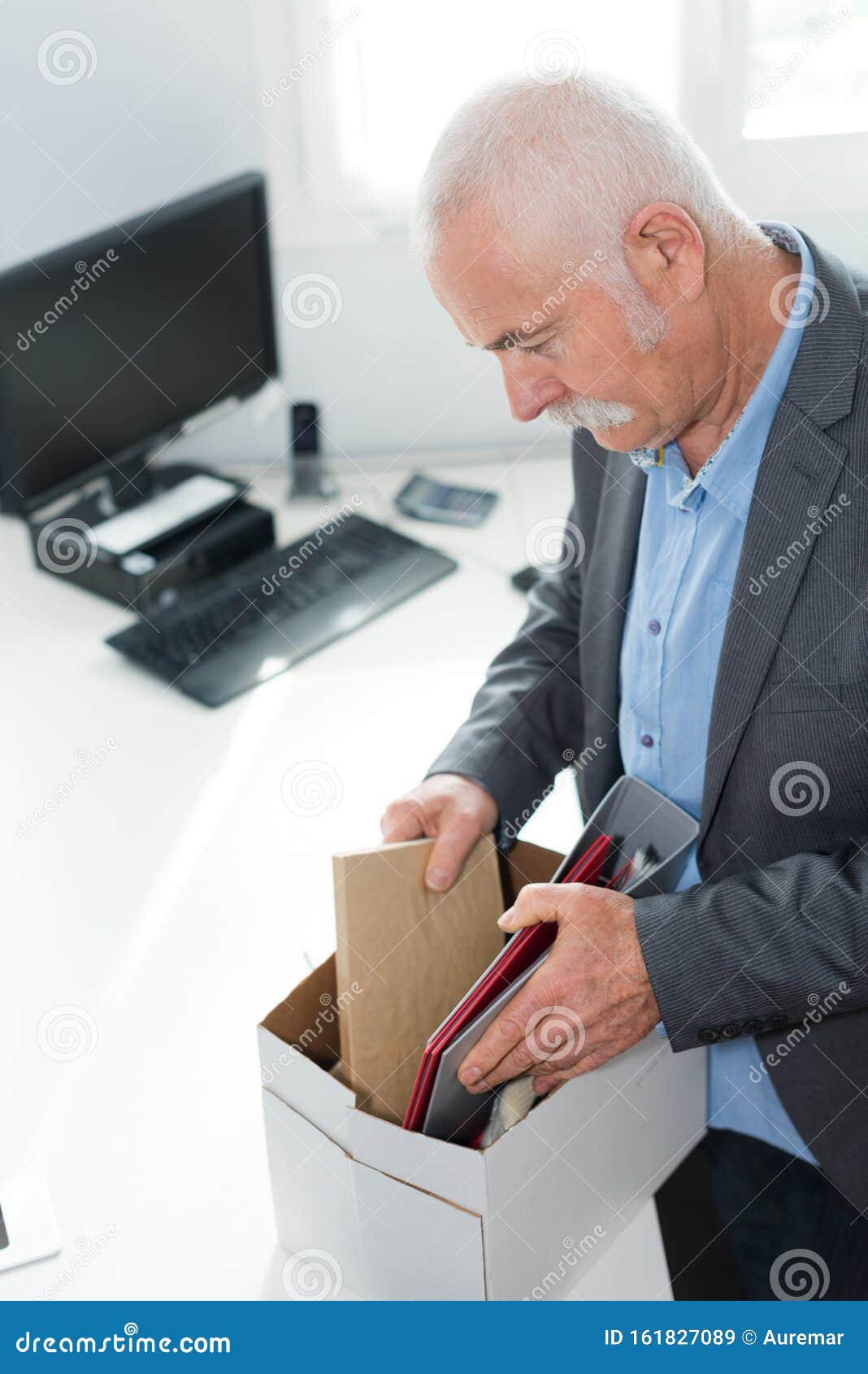 Senior Man Packing Up Belongings in Office Stock Image - Image of ...