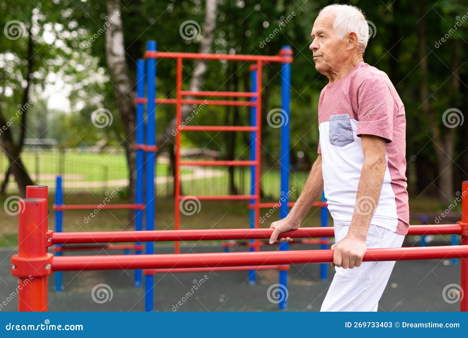 Senior Man Performing Parallel Bar Exercises in Park Stock Image ...