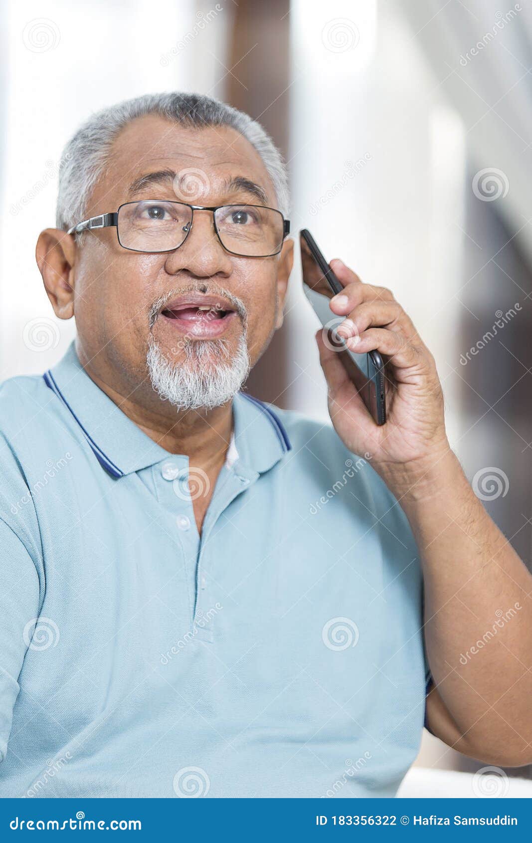 Senior man on the phone stock photo. Image of expression - 183356322